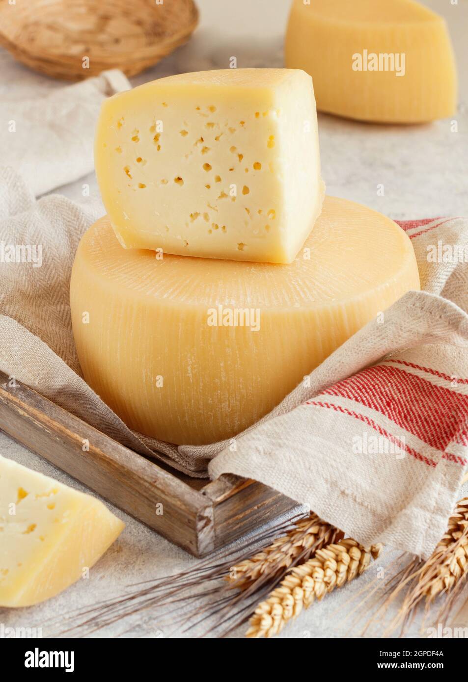 Pieces of fresh homemade cheese on a wooden tray close up Stock Photo ...