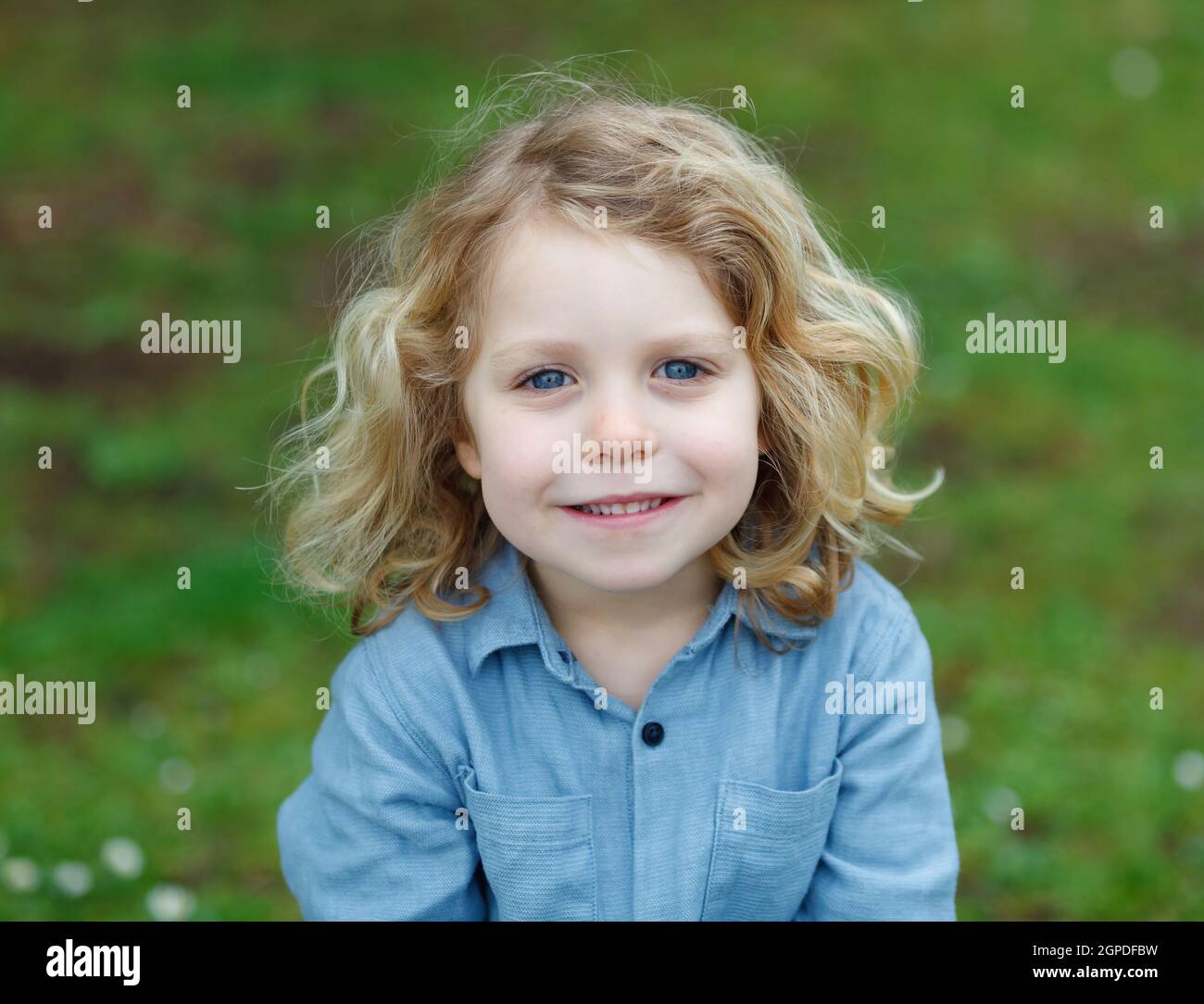 Happy small child with long blond hair enjoying the nature Stock Photo ...