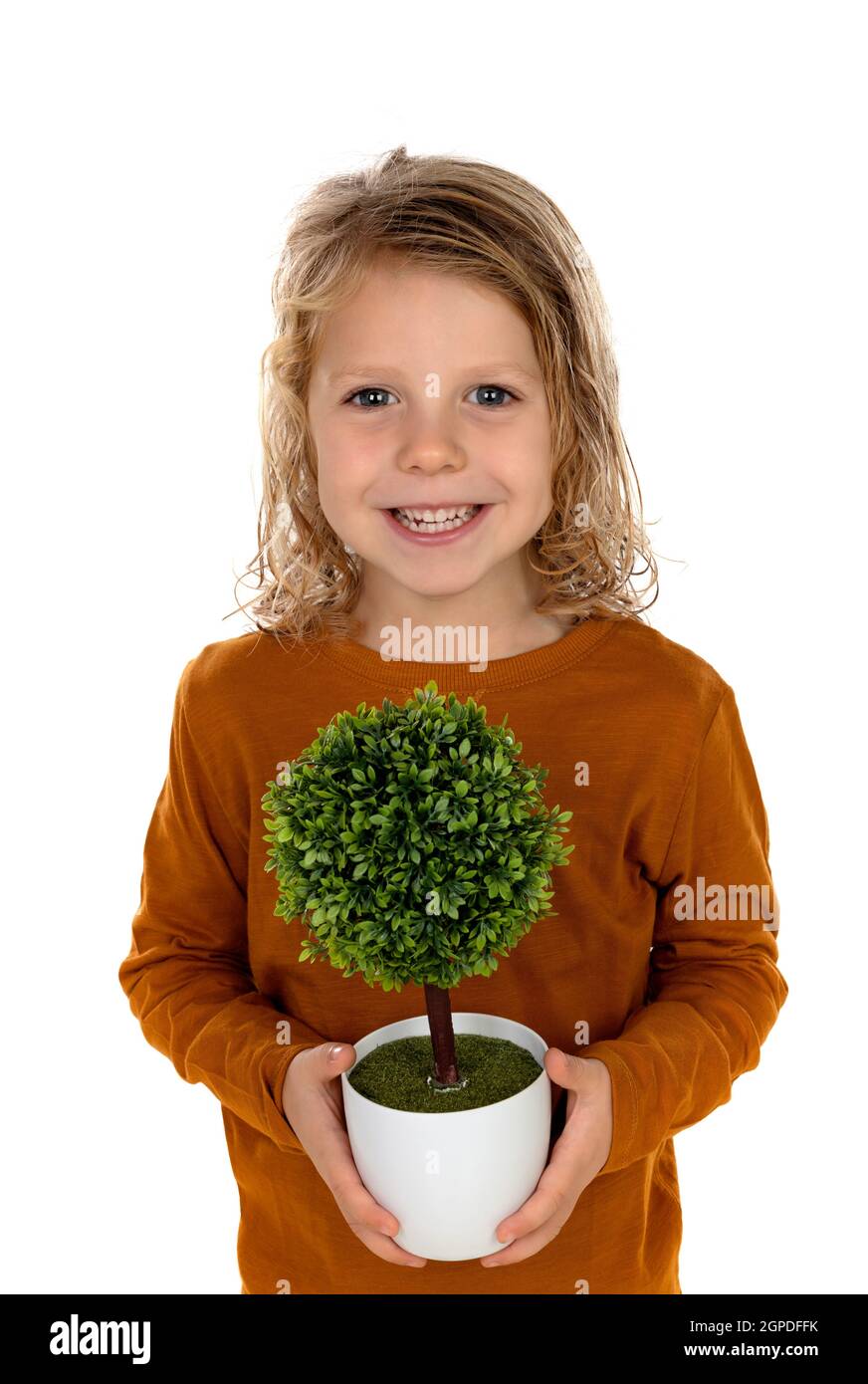 Happy child with a small tree isolated on a white background Stock ...