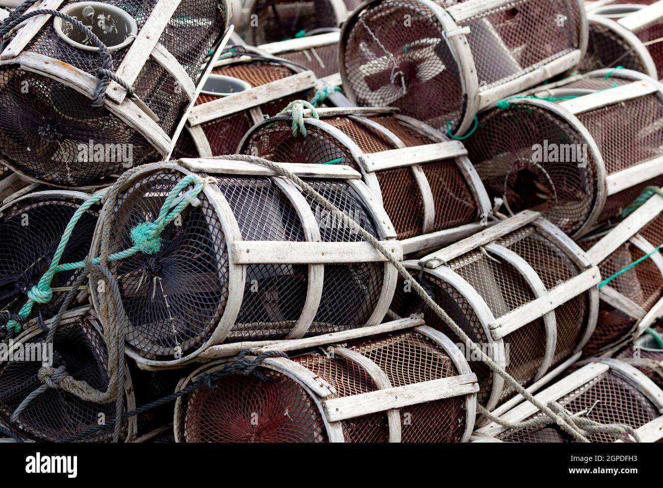Many octopus traps stacked at the port Stock Photo - Alamy