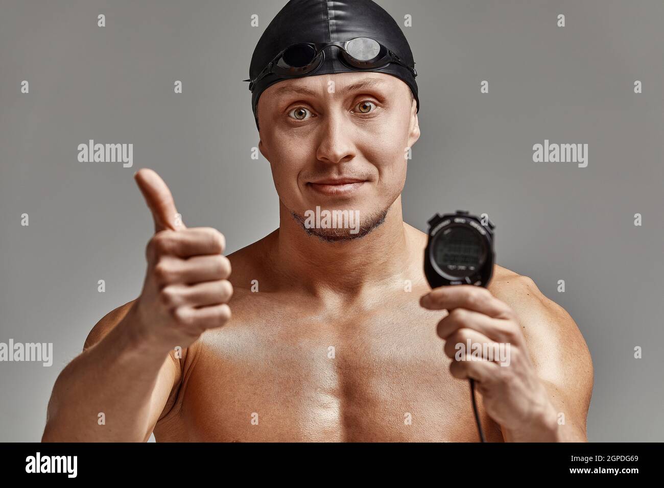 A coach with a stopwatch in his hands, a sports swimming coach with a ...