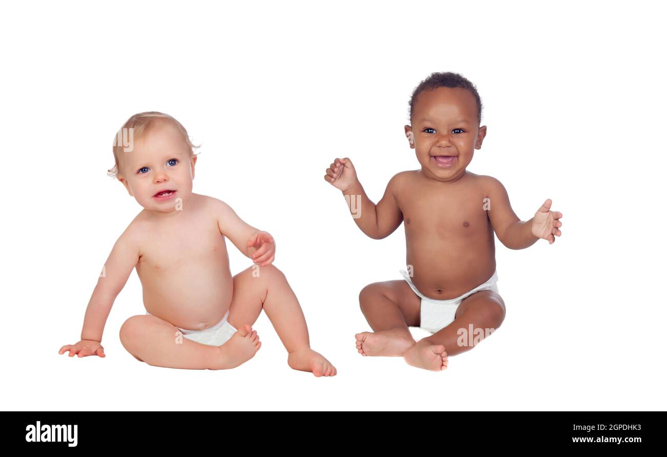 Two happy babies of different races isolated on a white background ...