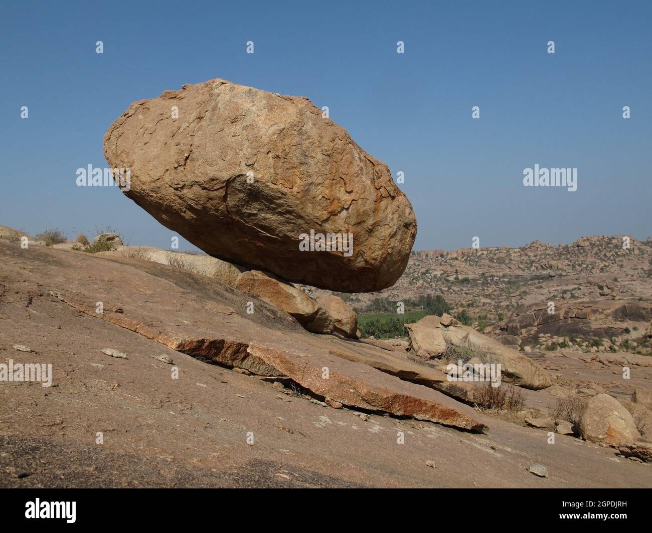 Big balancing granite boulder Stock Photo - Alamy