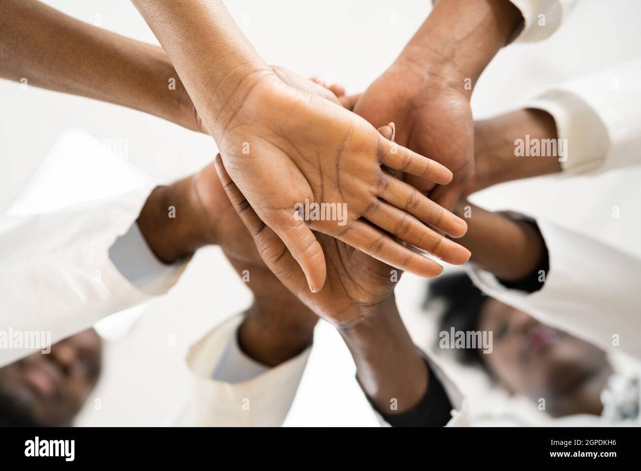 African American Medical Team Staff Hands Stack Stock Photo - Alamy