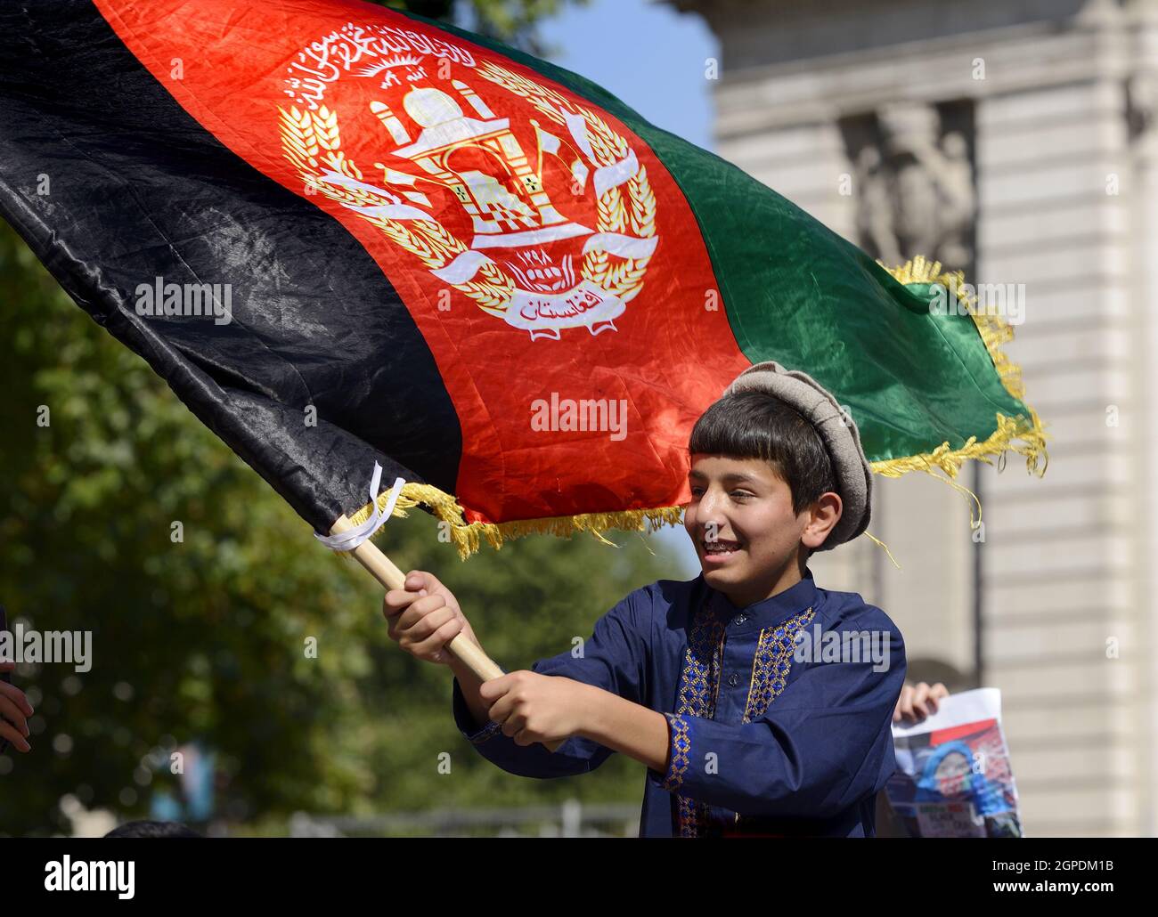London, UK. 7th Sep, 2021. Young Afghan boy waving an Afghan flag ...