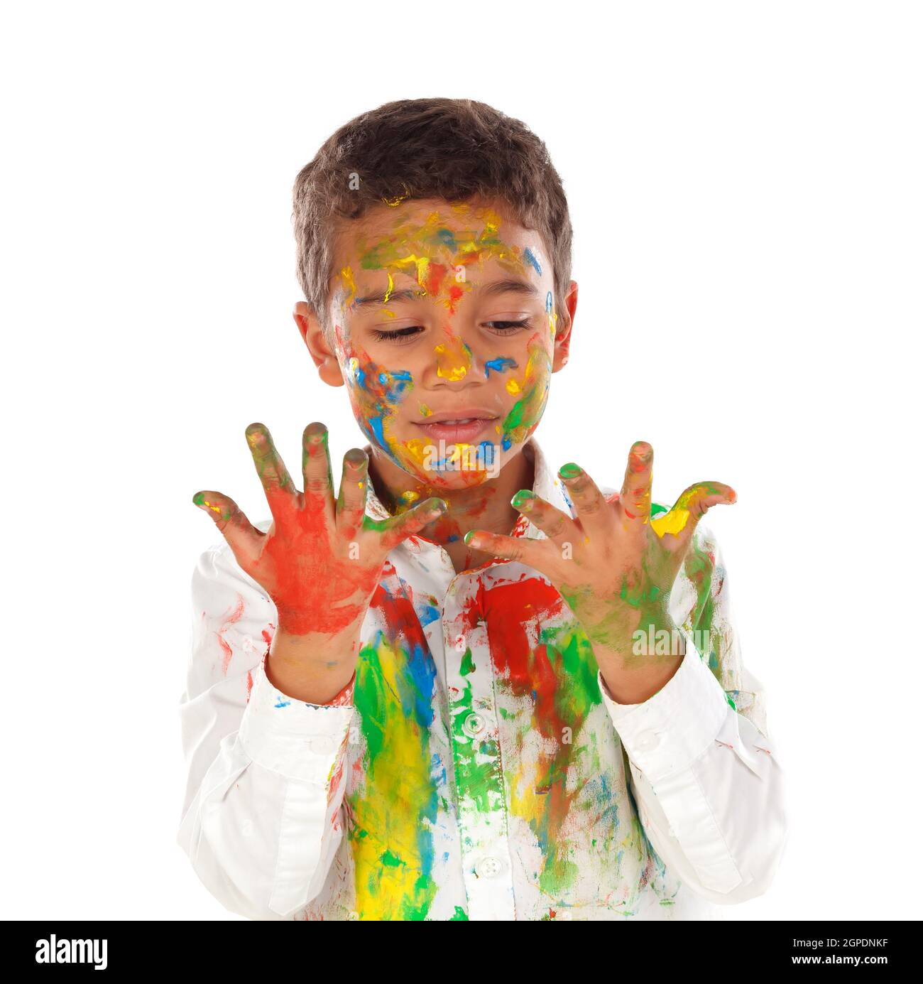 Funny boy with hands and face full of paint isolated on a white ...