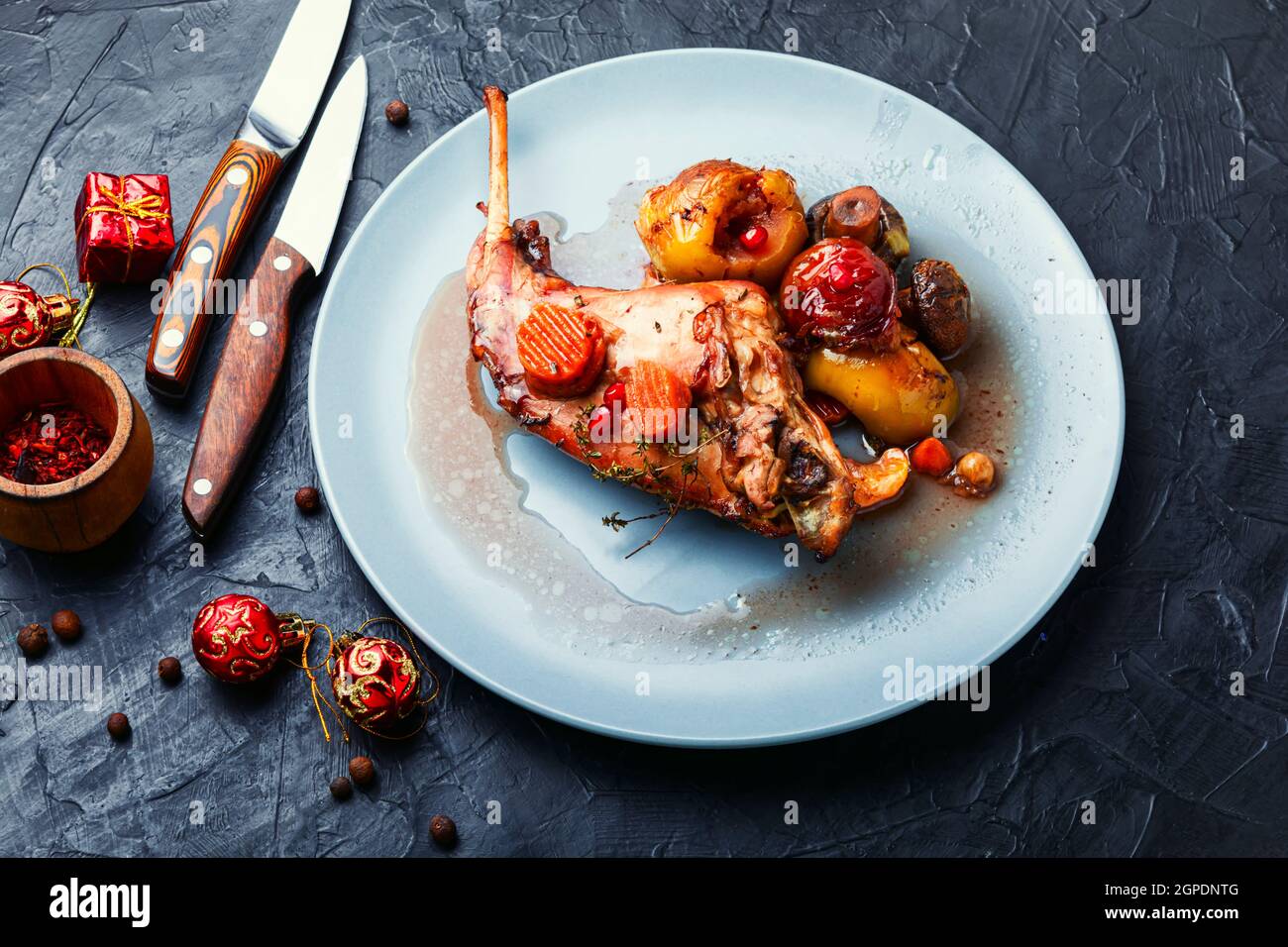 Braised rabbit meat with fruits.Baked meat for the Christmas table ...