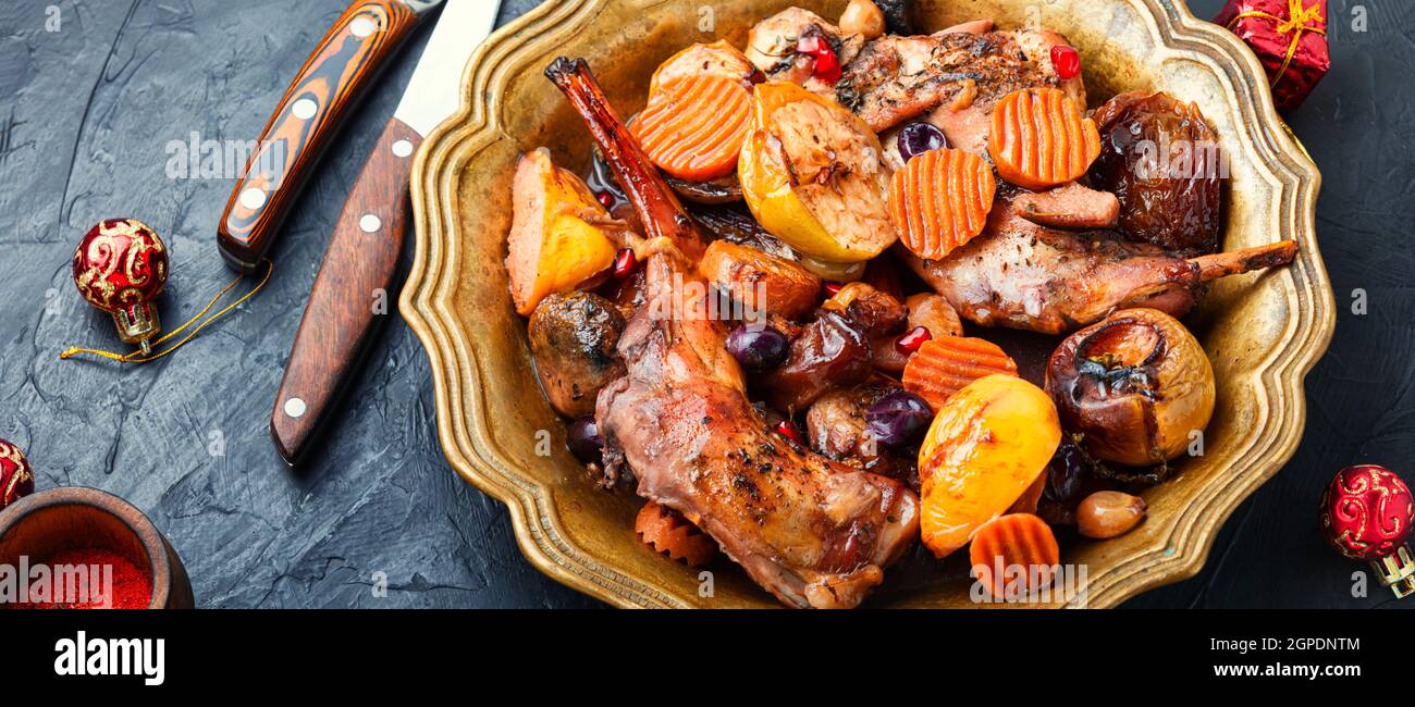 Braised rabbit meat with fruits.Baked meat for the Christmas table ...