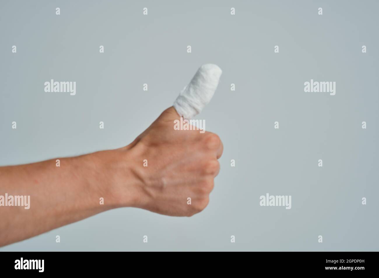 male patient bandaged hand injury to fingers light background Stock ...