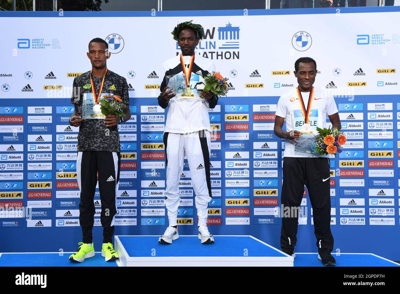 Third place finisher kenenisa bekele eth pose with medals berlin ...