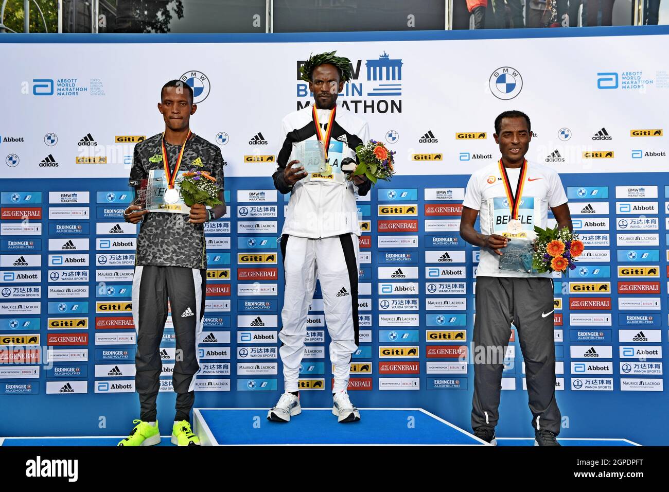 Third place finisher kenenisa bekele eth pose with medals berlin ...