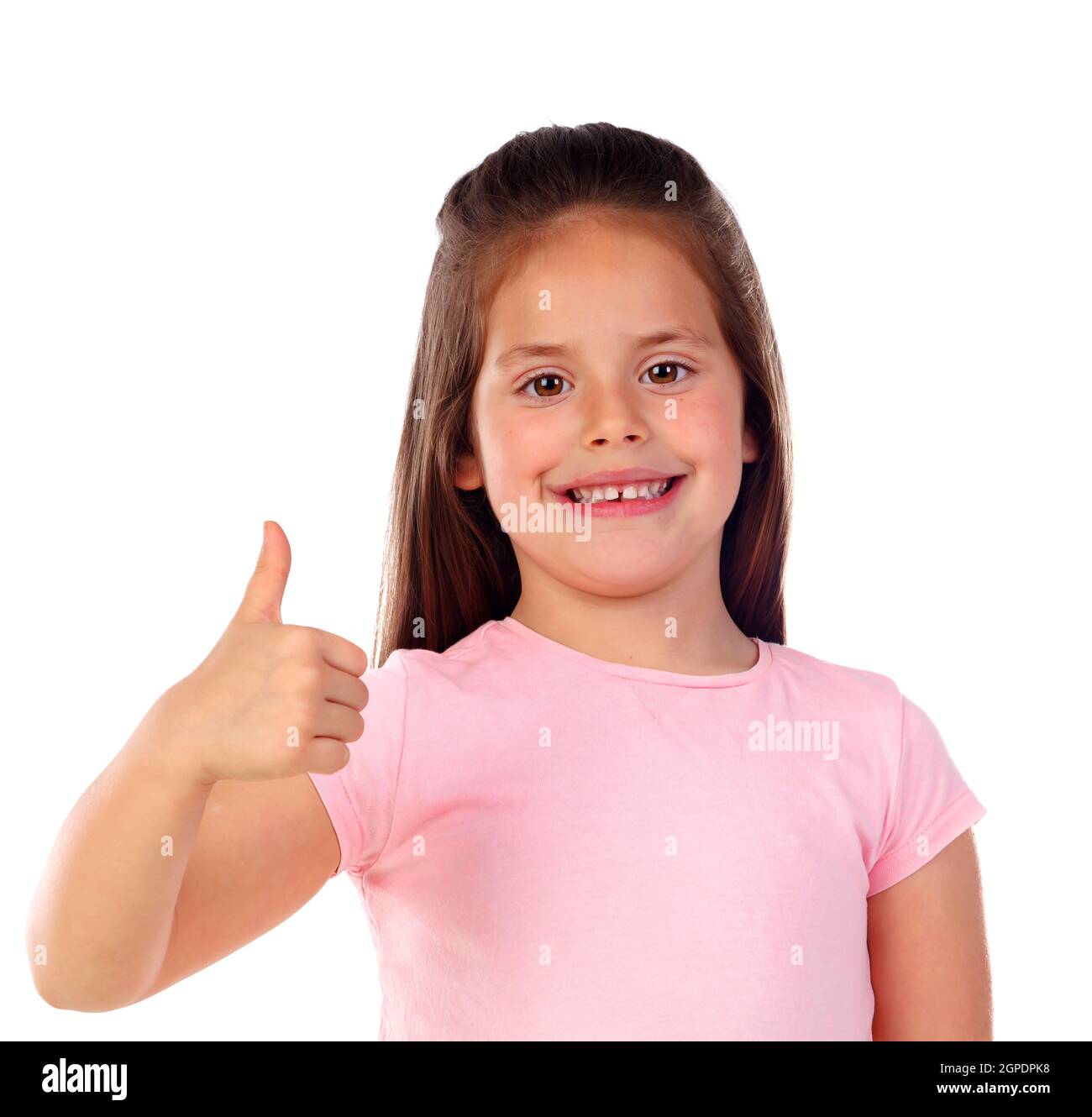 Friendly child saying Ok with her thumb isolated on a white background ...