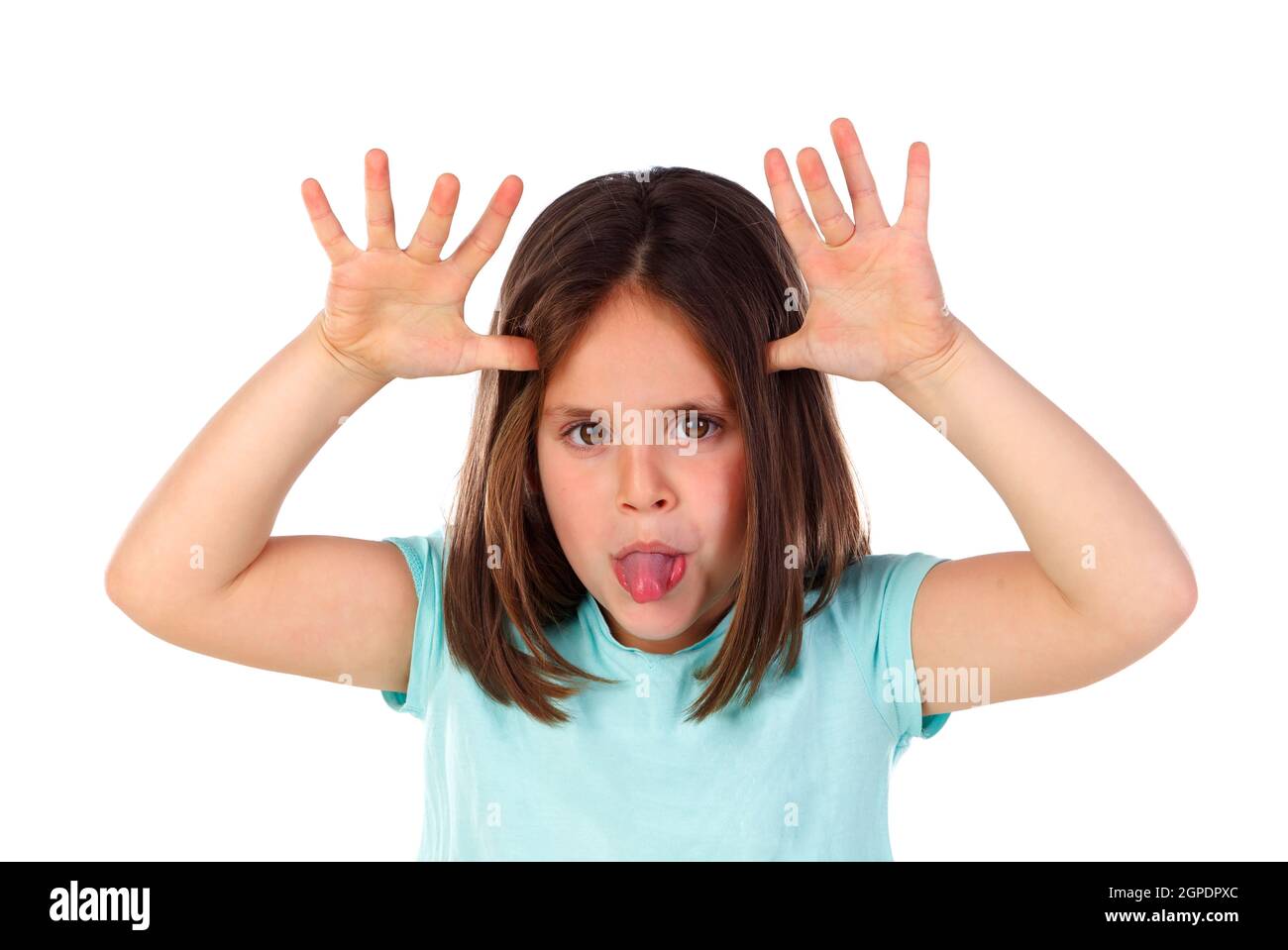 Funny girl with blue shirt making fun looking at camera isolated on a ...