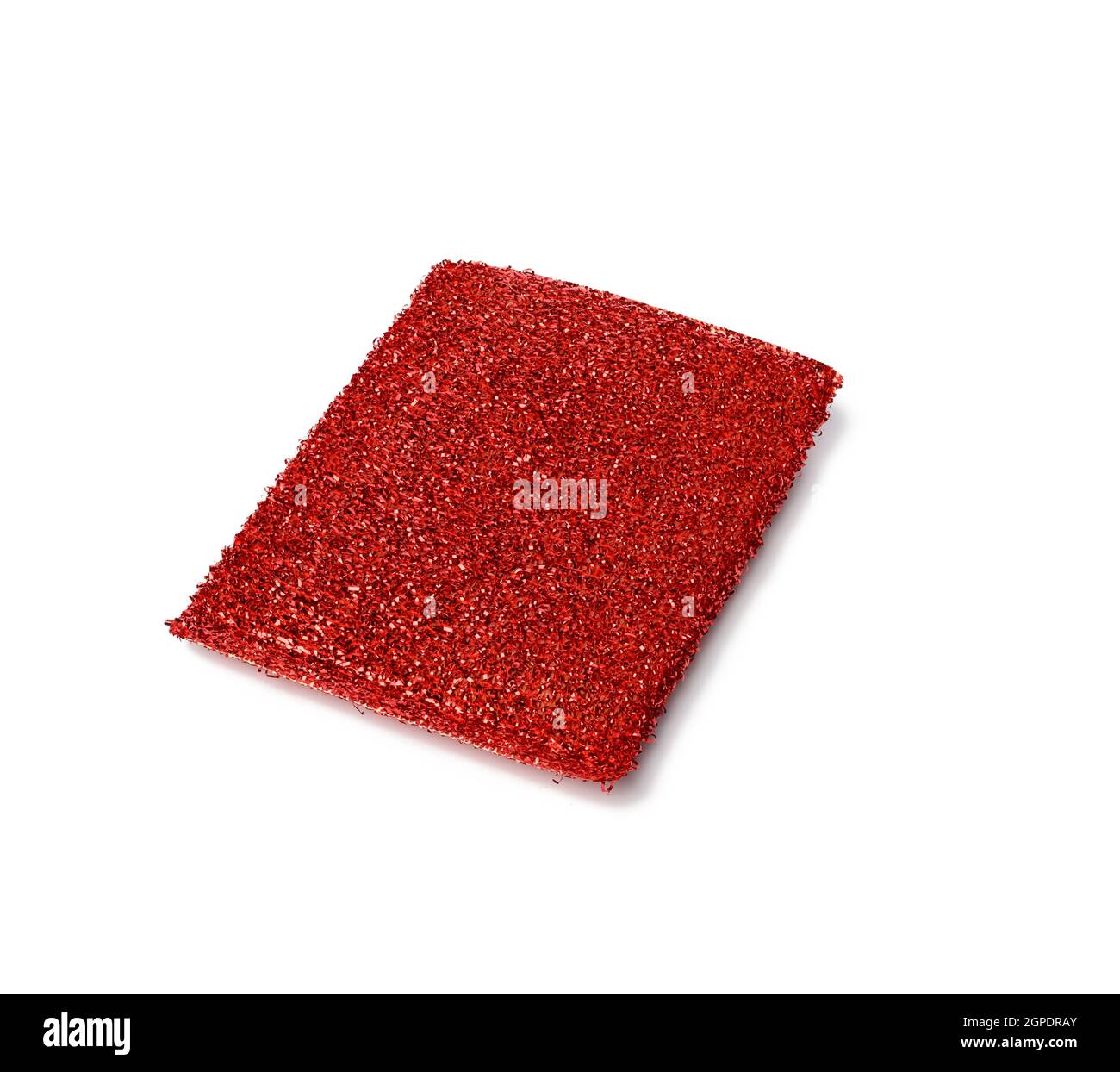 new red metal sponge for washing dishes isolated on white background ...
