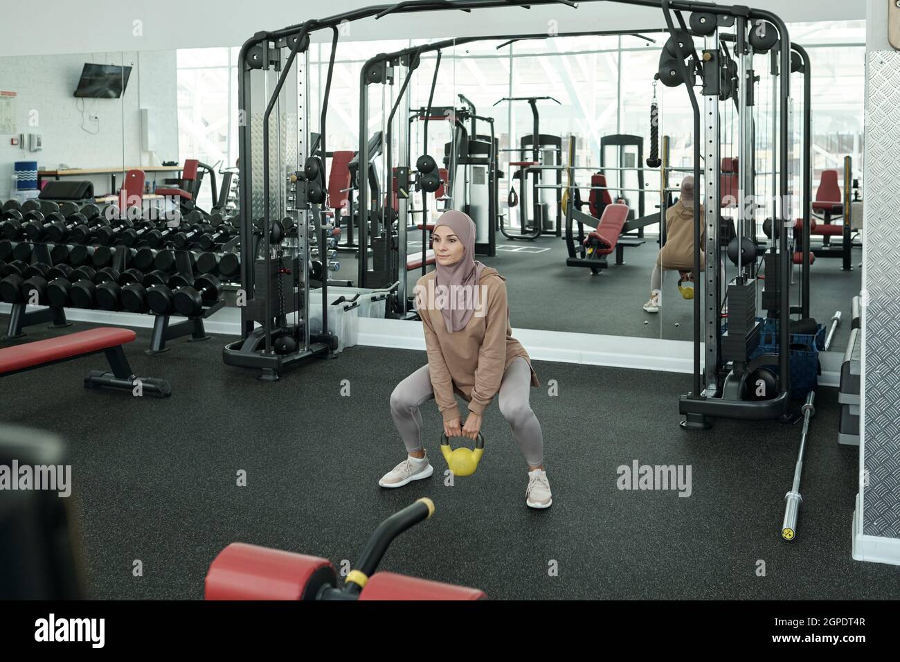 Horizontal long shot of beautiful sporty Muslim woman wearing hijab ...