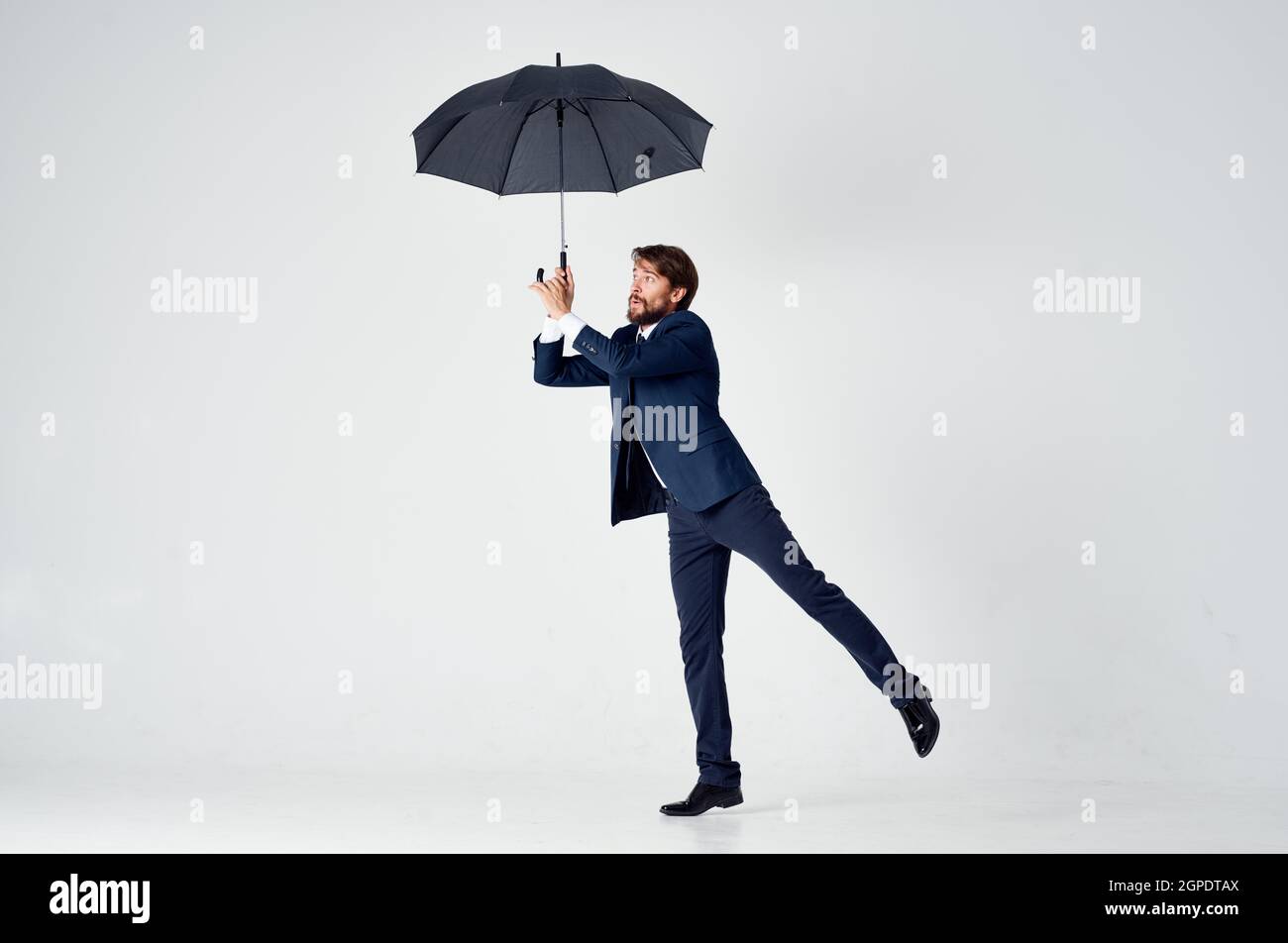 business man in suit umbrella protection self-confidence studio Stock ...