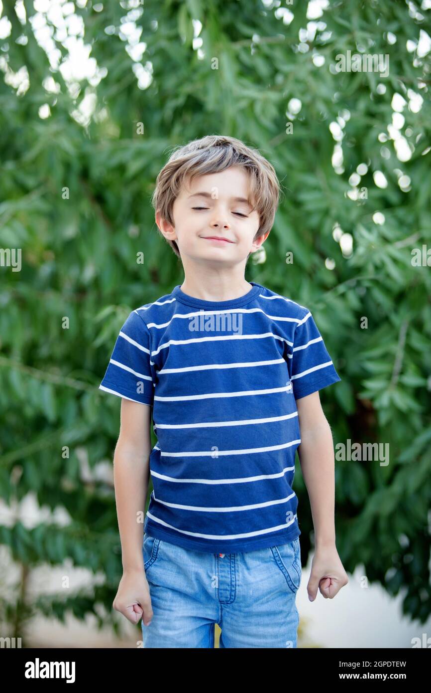 Relaxed child with closed eyes dreaming in the garden Stock Photo - Alamy