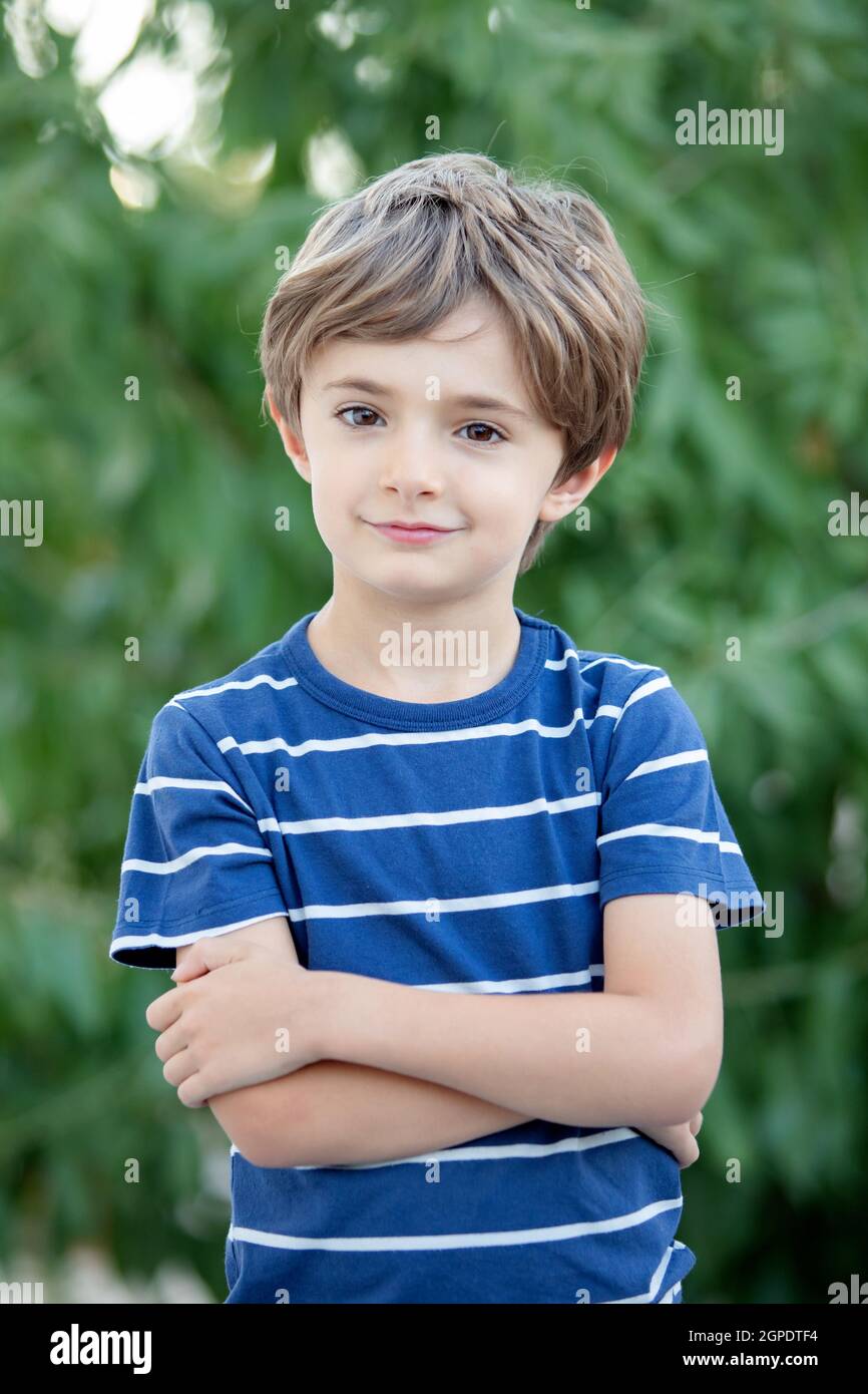 Adorable small child in the field looking at camera Stock Photo - Alamy