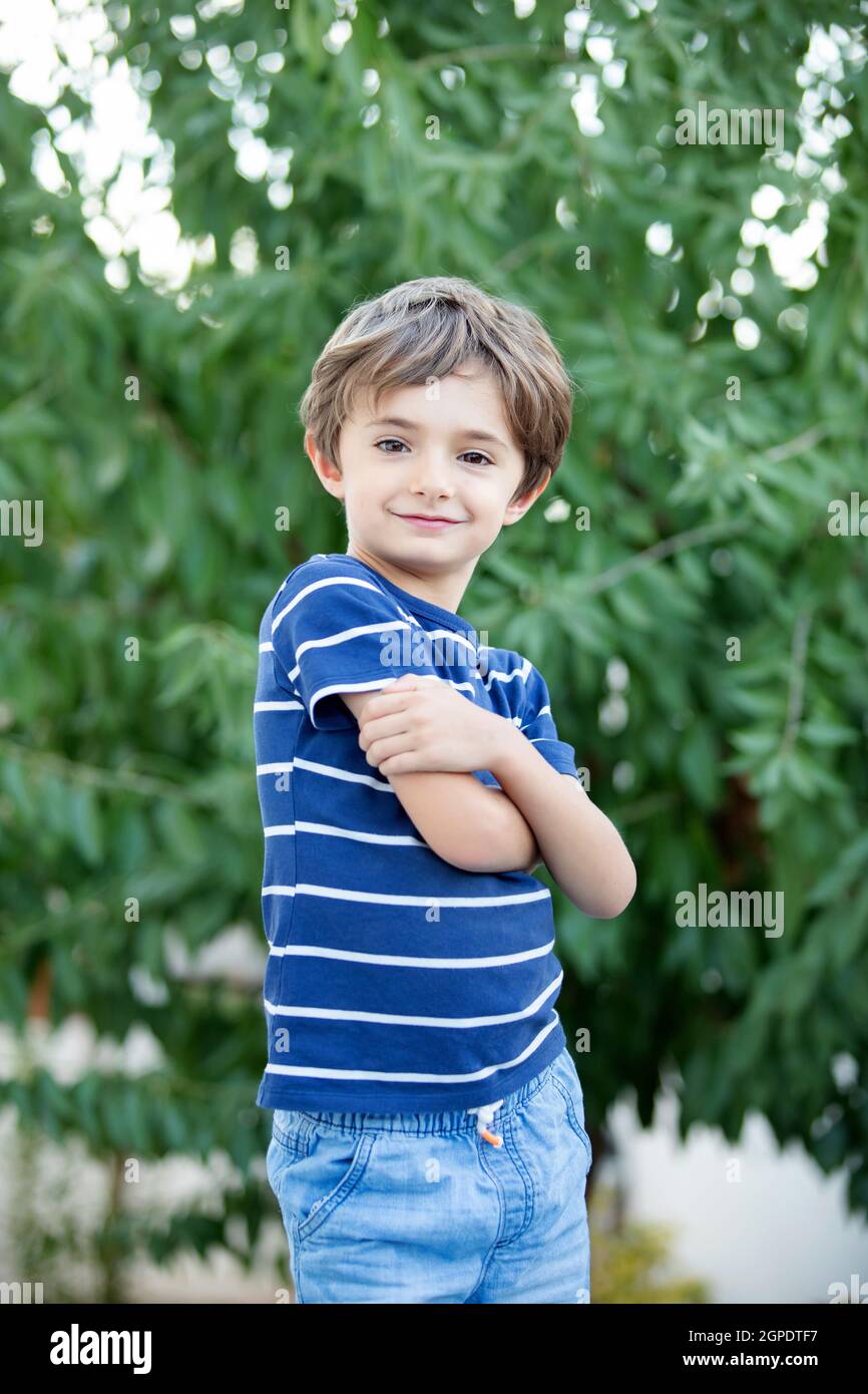 Adorable small child in the field looking at camera Stock Photo - Alamy