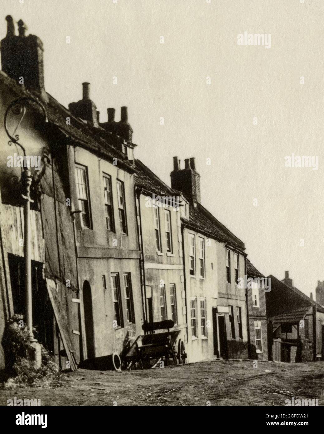 Scruffy houses with sash windows on a slope in Whitby, Yorkshire ...