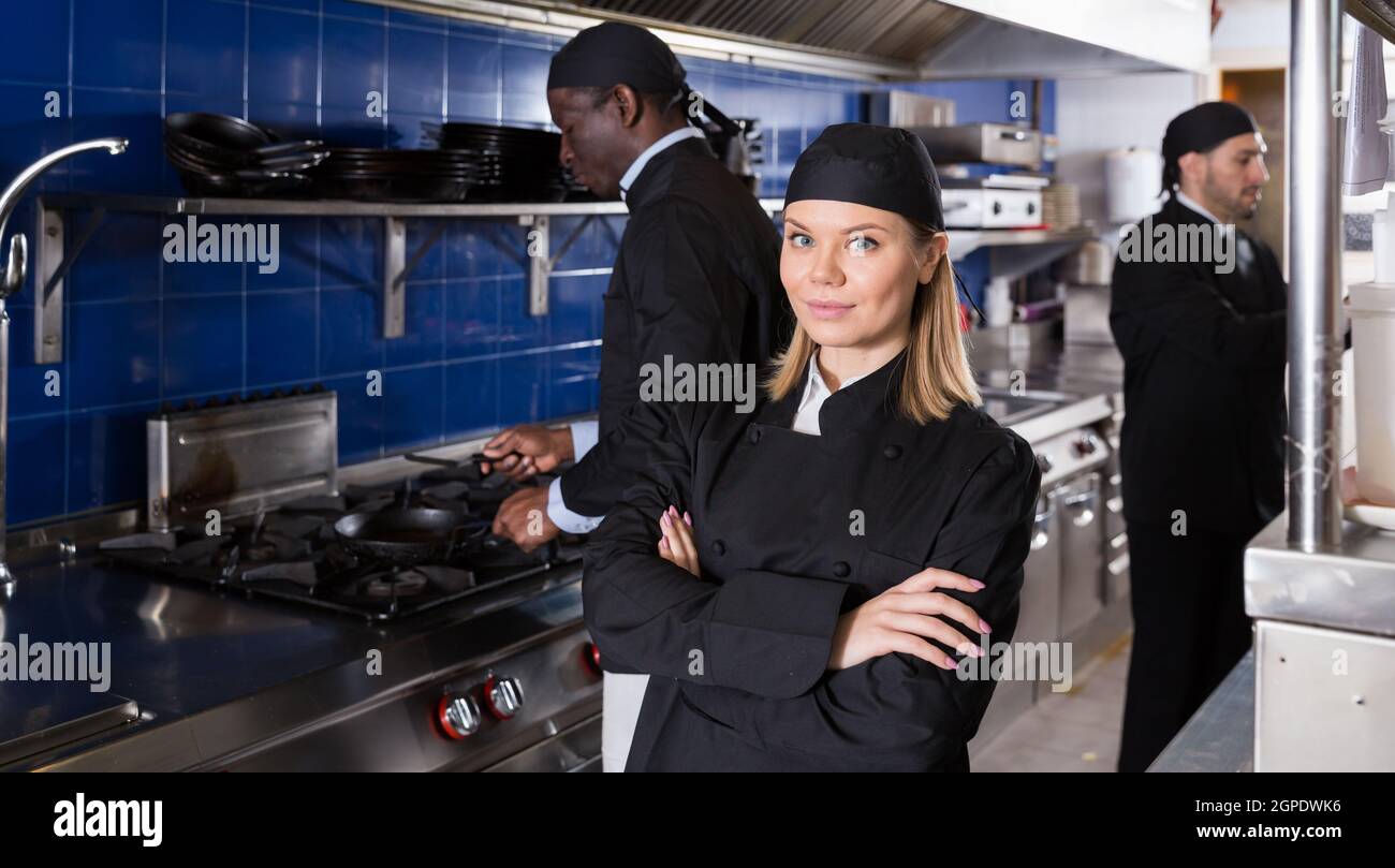 Female chef of restaurant in kitchen Stock Photo - Alamy