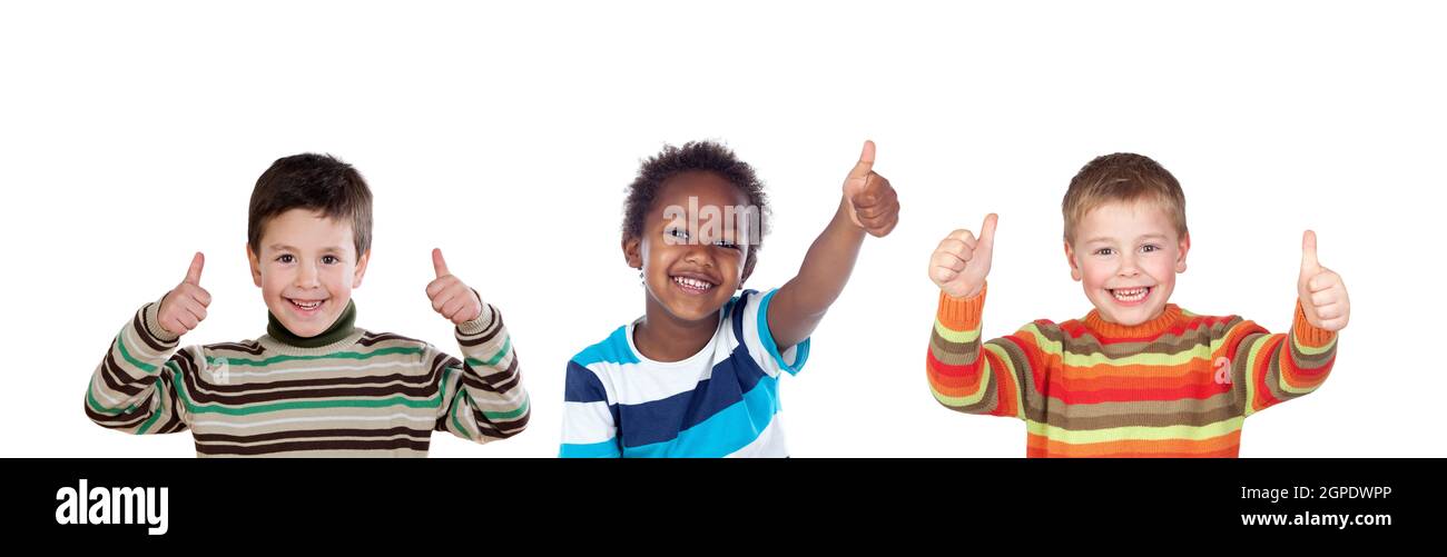 Happy classmates saying Ok with their thumbs up isolated on a white ...