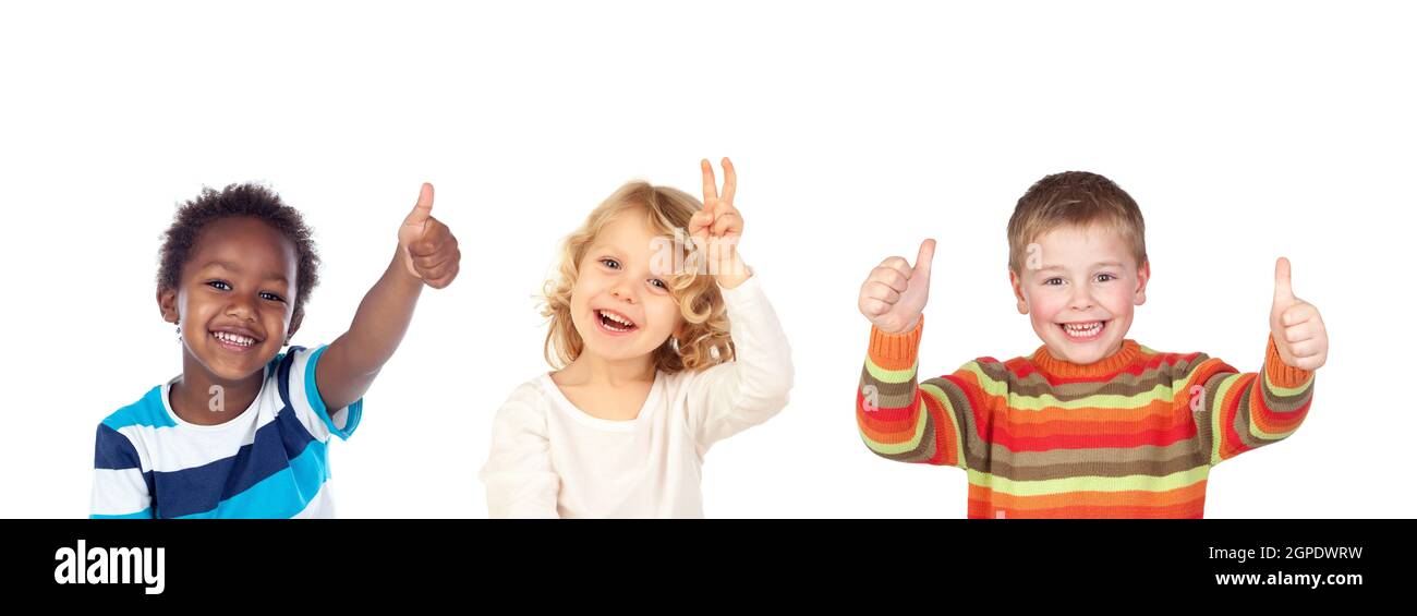 Happy classmates saying Ok with their thumbs up isolated on a white ...