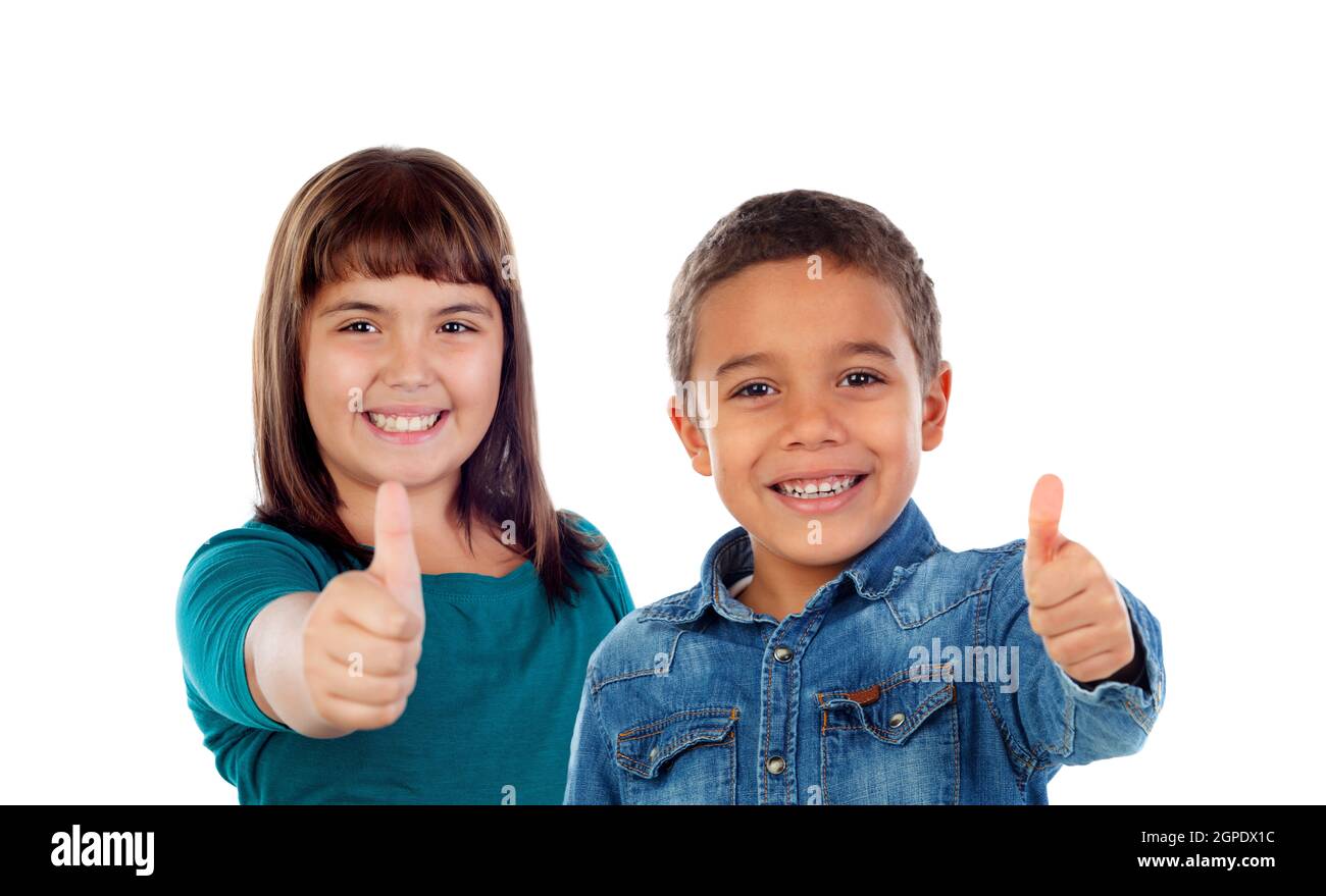 Happy children saying Ok with the thumb up isolated on a white ...