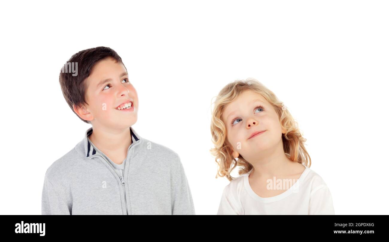 Two children looking up isolated on a white backround Stock Photo - Alamy