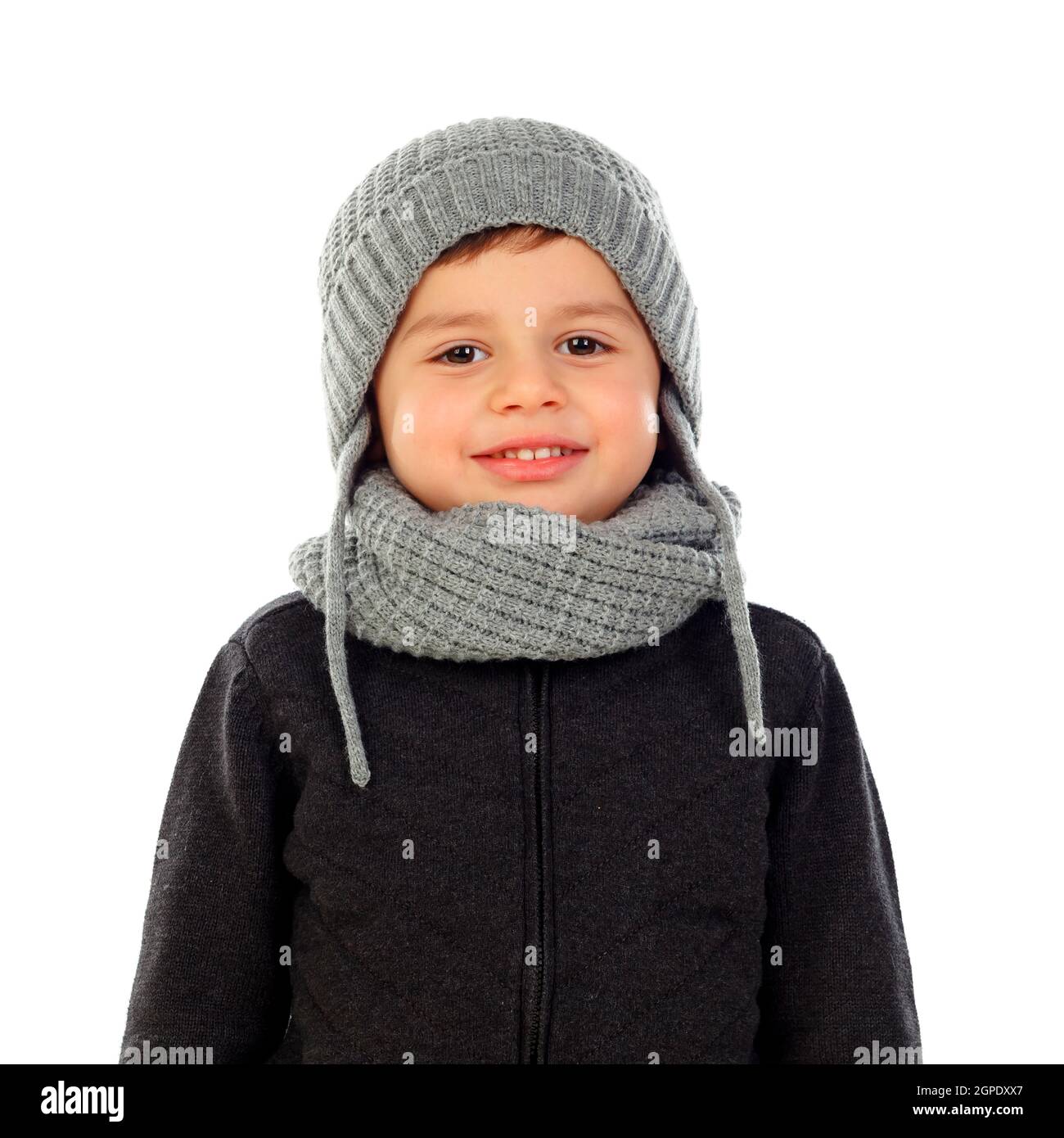 Beautiful child with wool scarf and coat isolated on a white background ...
