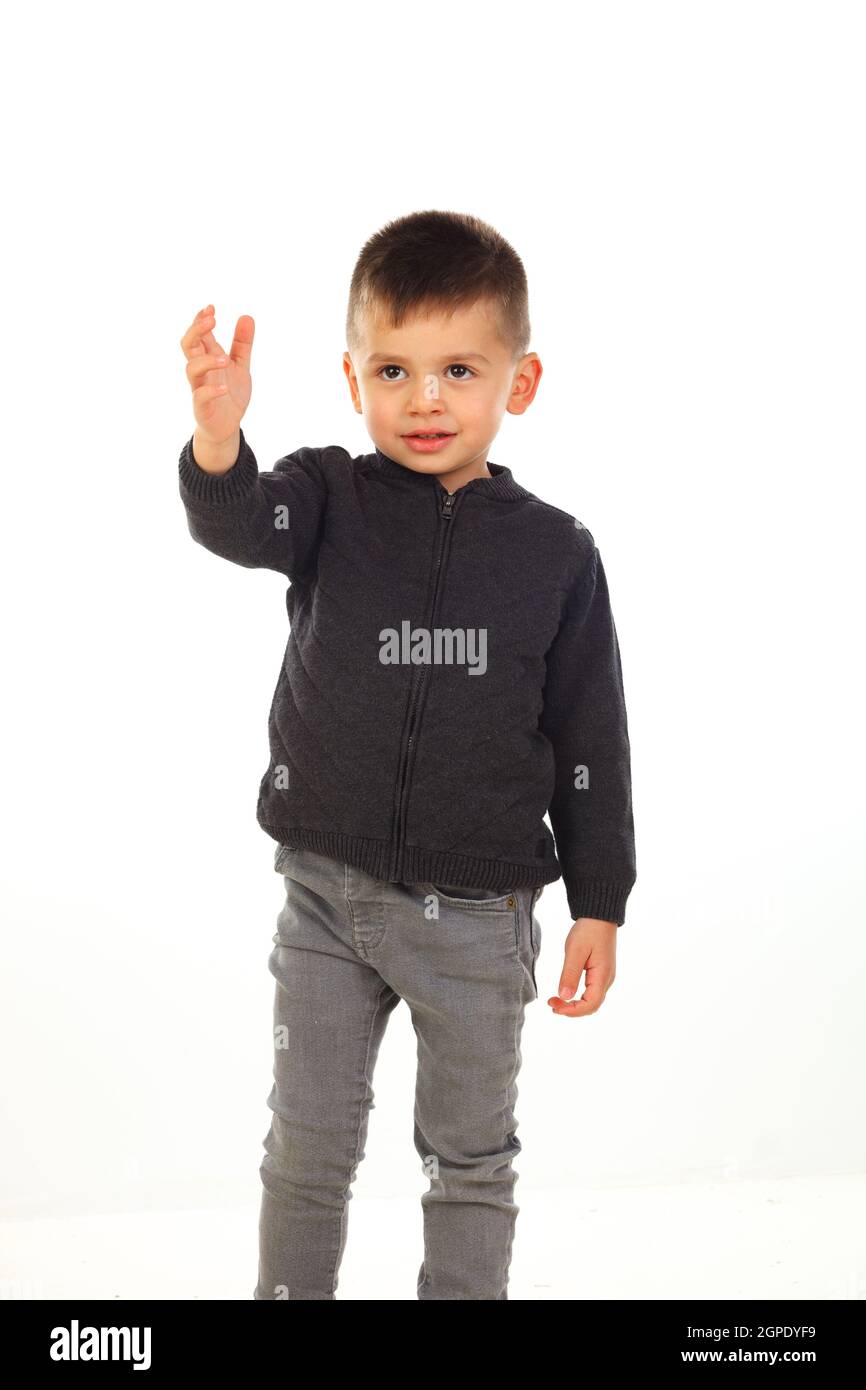 Beautiful child indicating something with his hand isolated on a white ...