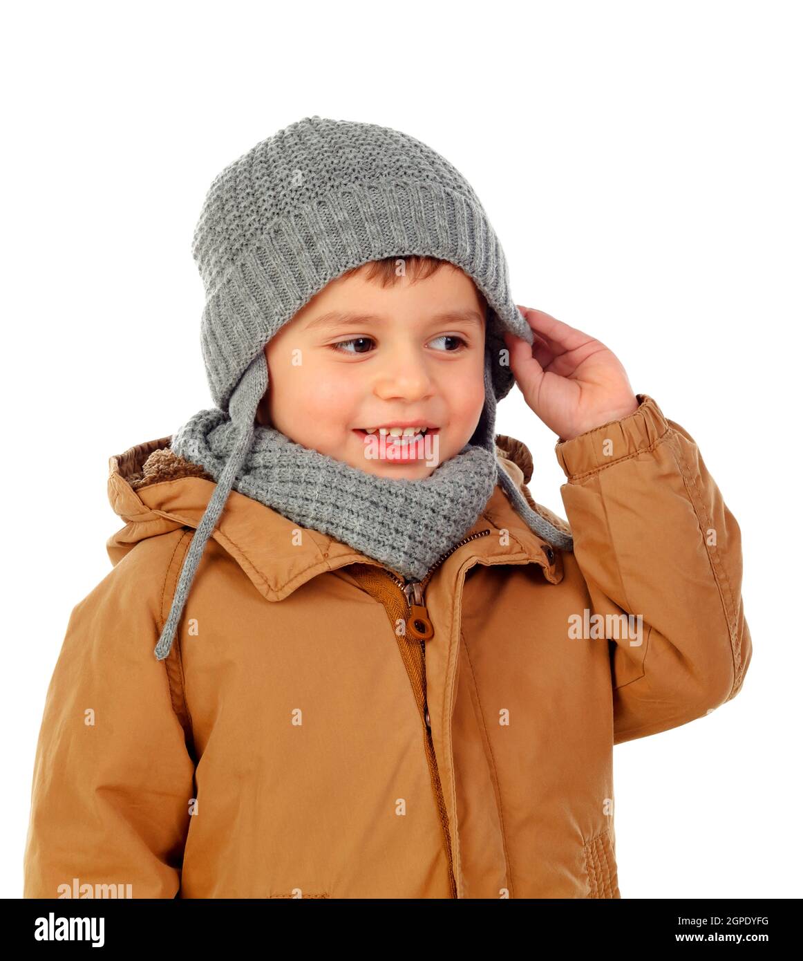 Beautiful child with wool scarf and coat isolated on a white background ...