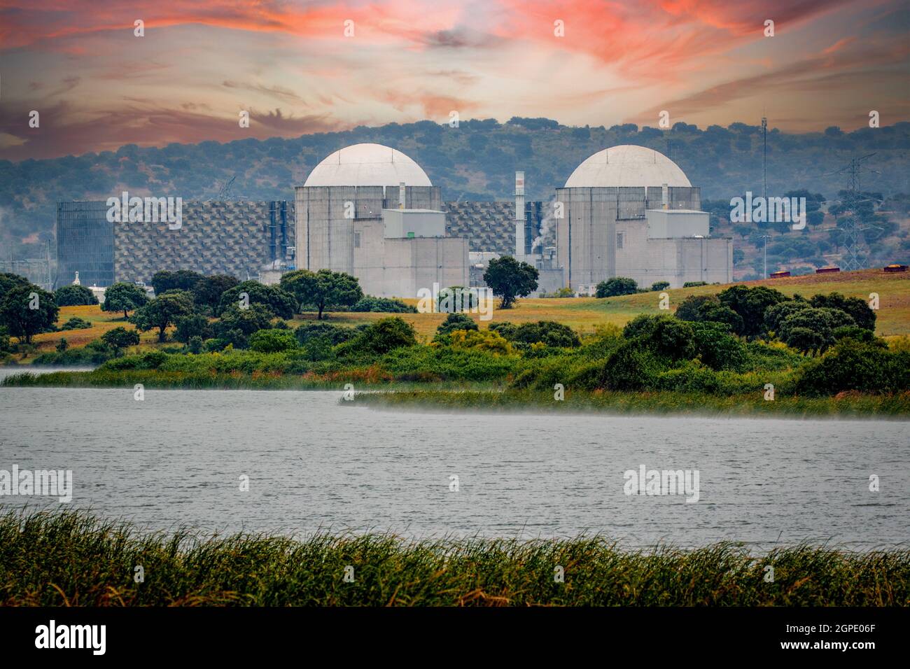 Spanish nuclear power plant next to a river with a stunning sky on the ...
