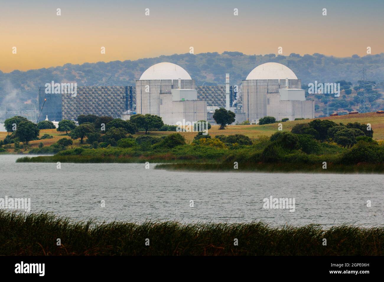 Spanish nuclear power plant next to a river with a stunning sky on the ...