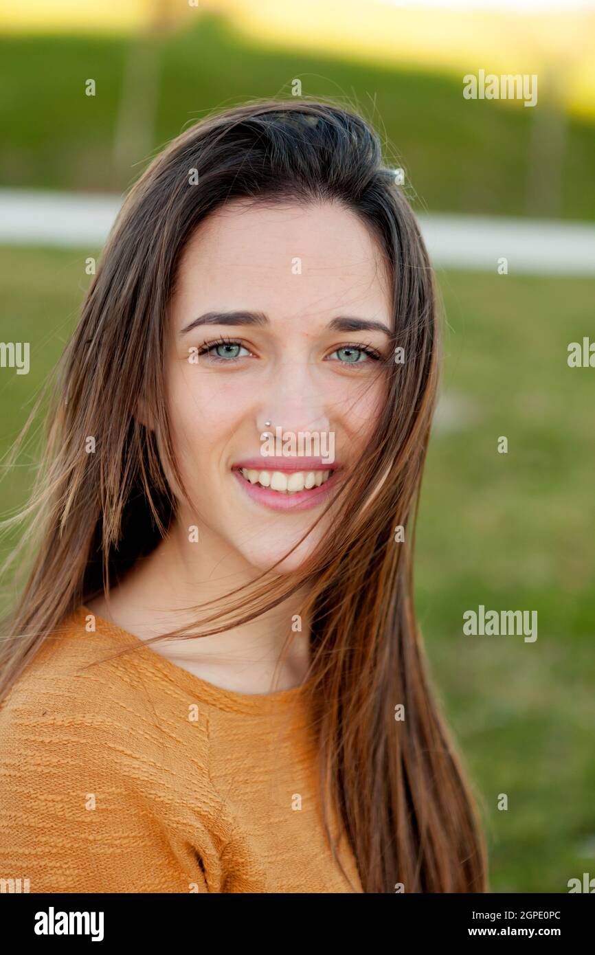 Outdoor portrait of beautiful happy teenager girl laughing with perfect ...