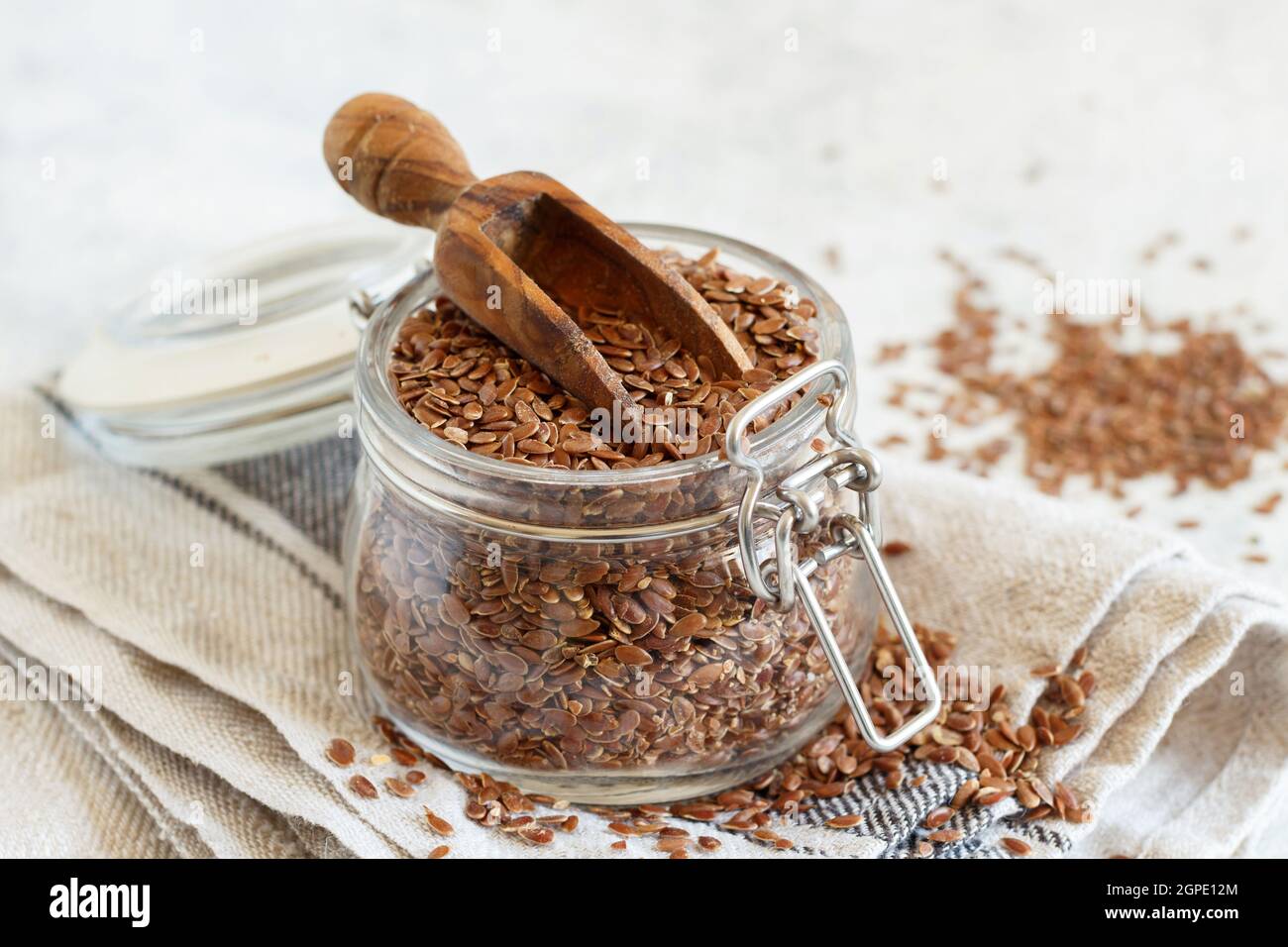 Raw Flax seeds in a jar with a scoop close up Stock Photo - Alamy