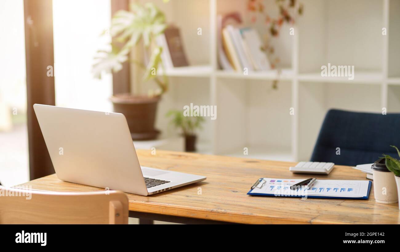 Bright and modern office workspace with laptop computer, business ...