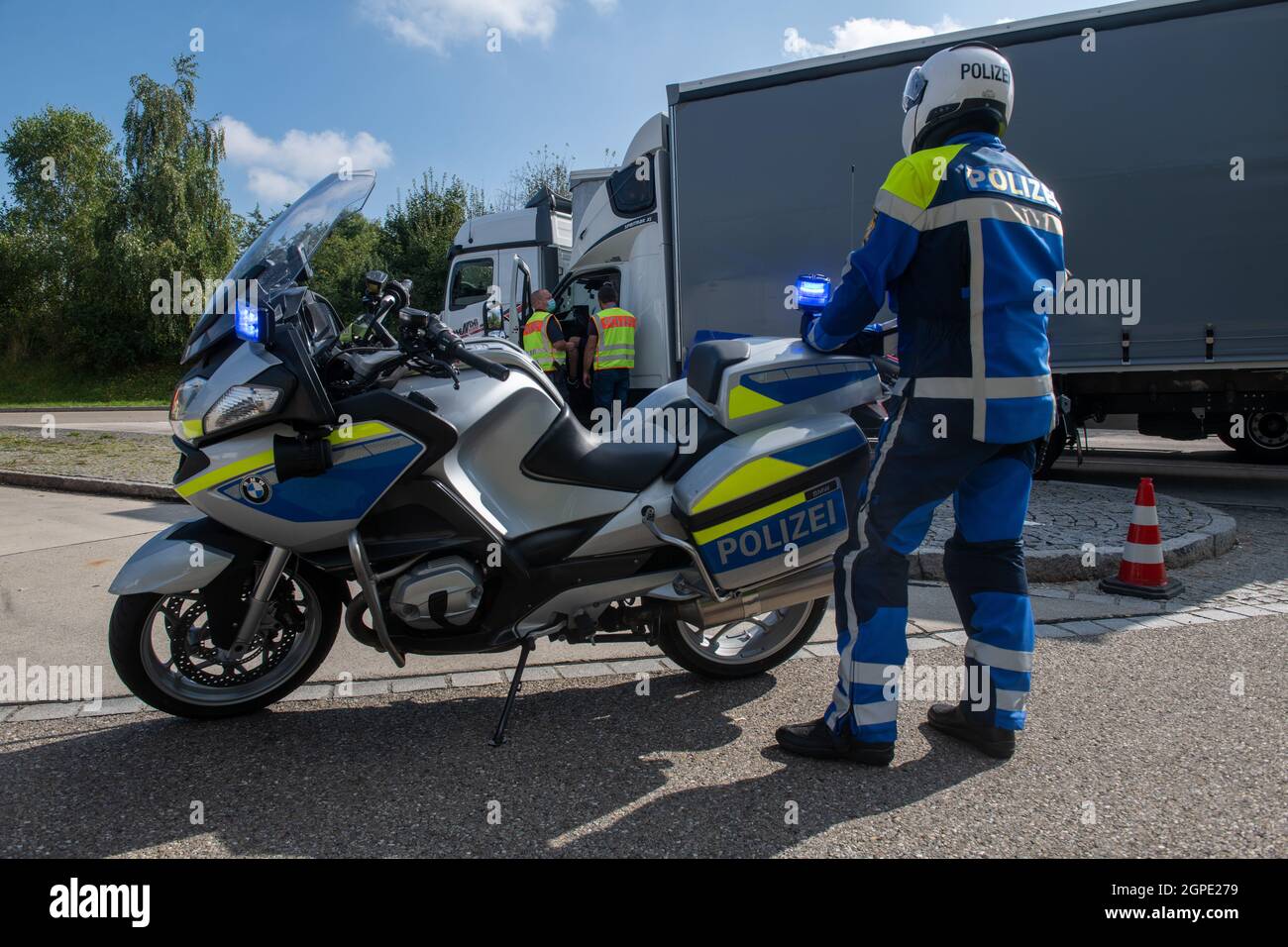 Hurlach, Germany. 27th Sep, 2021. A police officer of the motorcycle ...