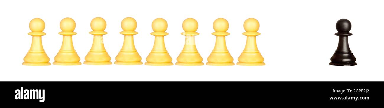 Many pawns yellow and other one black isolated on a white background ...