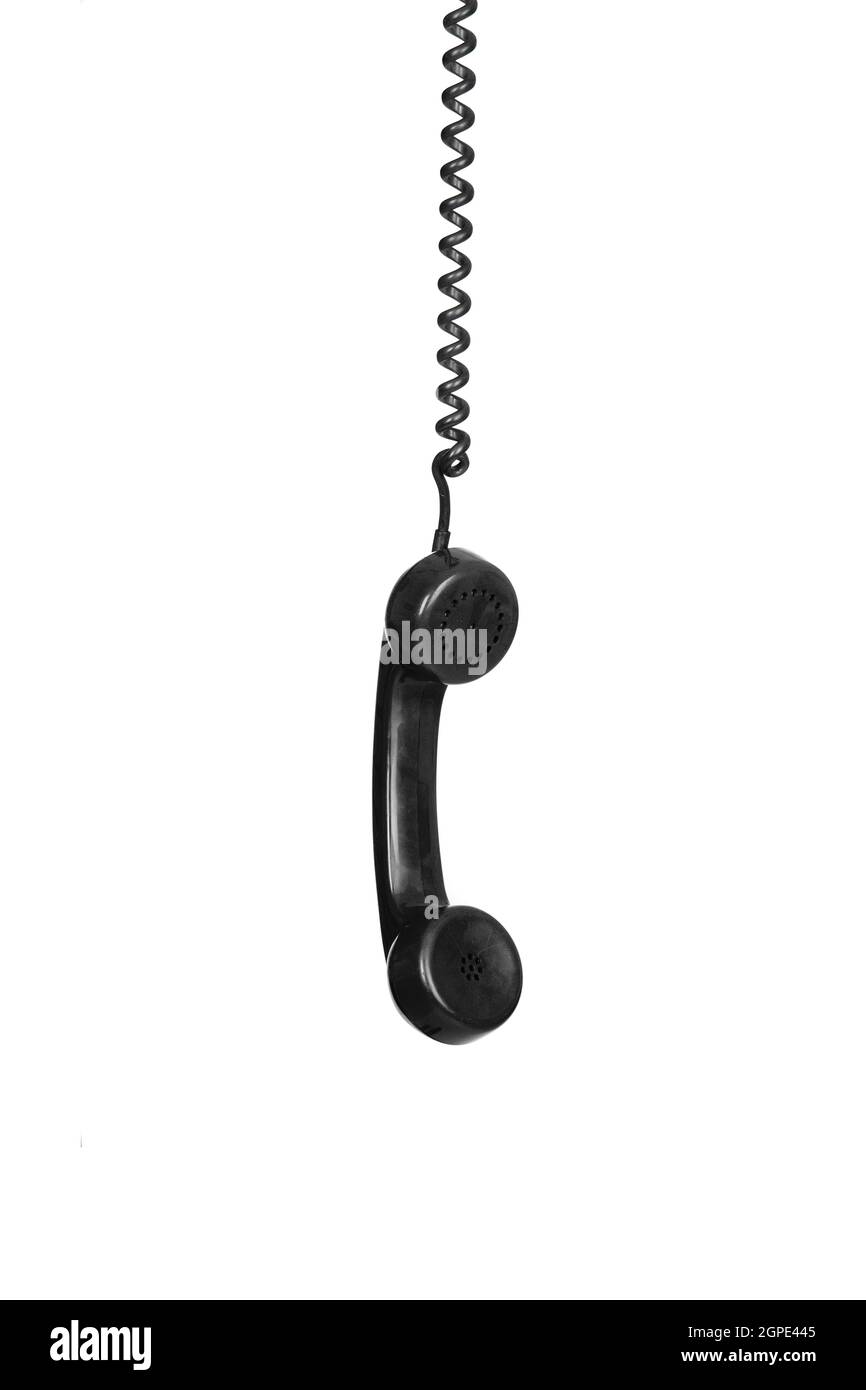 Old black phone hanging of a cable isolated on a white background Stock ...
