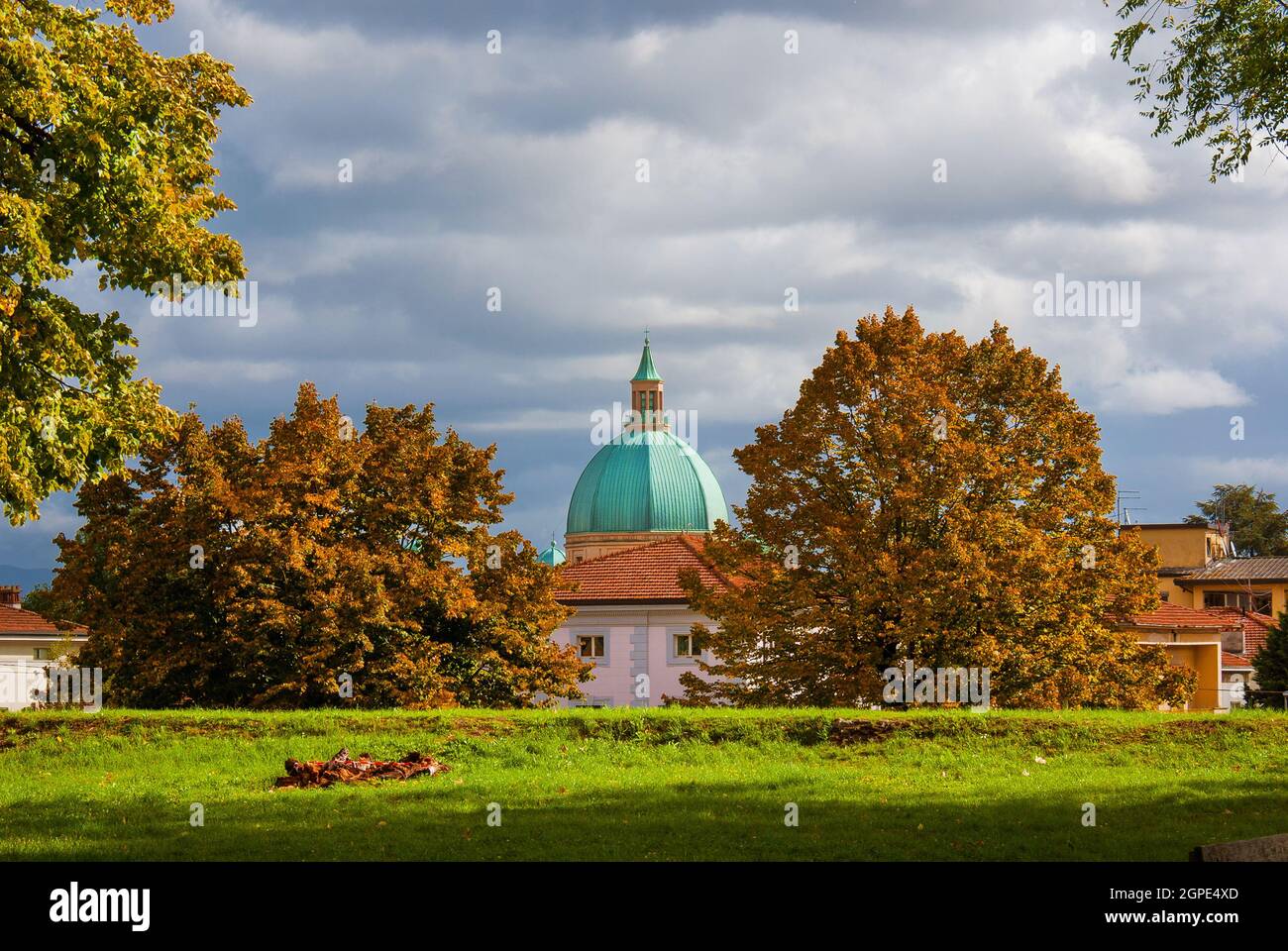 Autumn in Lucca. View of ancient walls public park with autumnal leaves ...