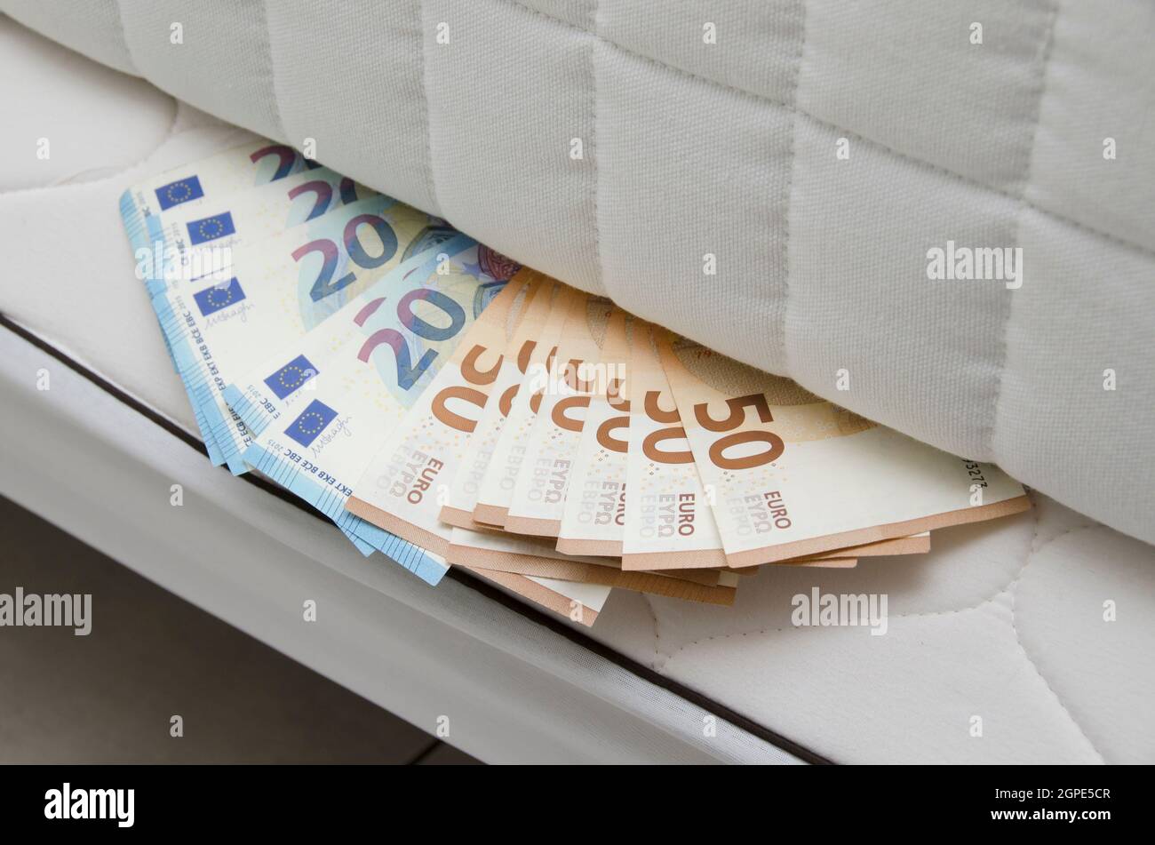 Money under the mattress hi-res stock photography and images - Alamy