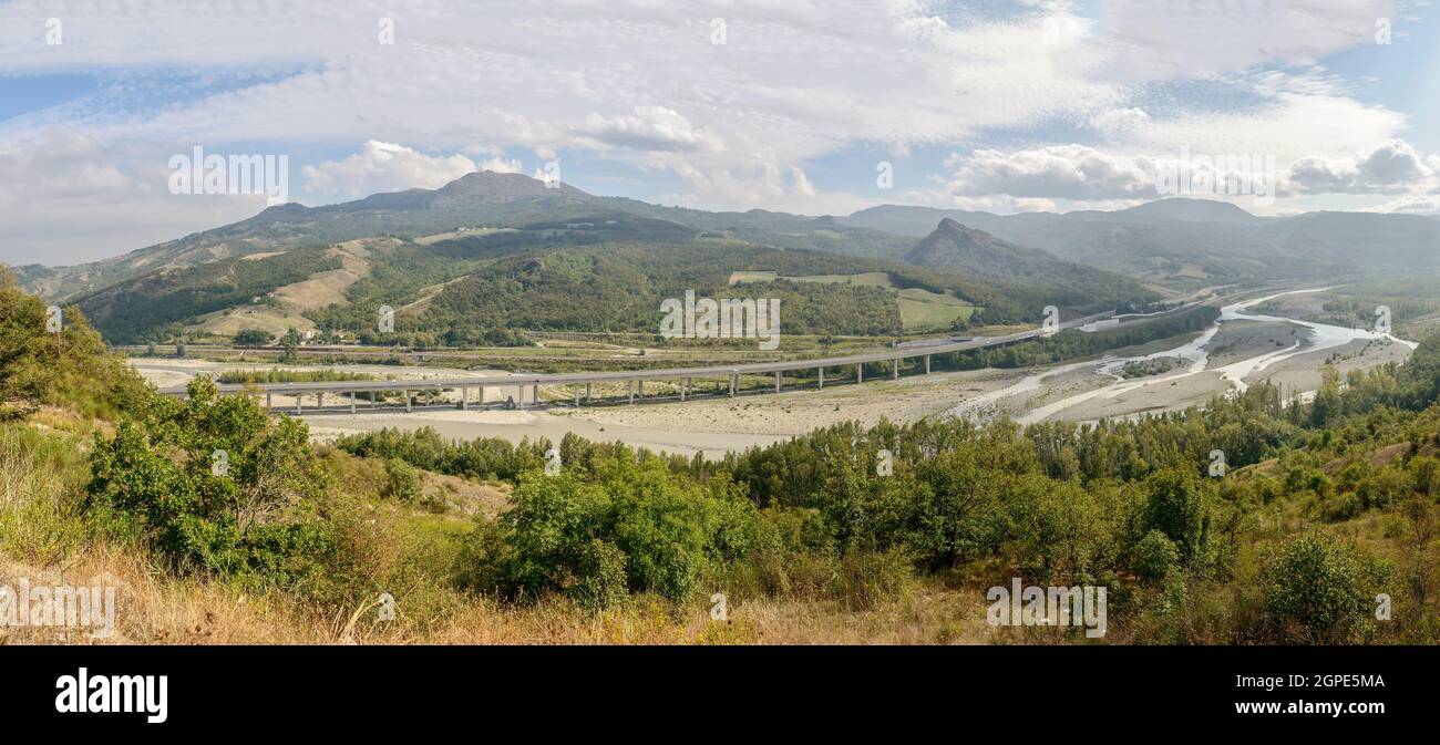 landscape of the Pennine Taro river valley with long Cisa highway ...
