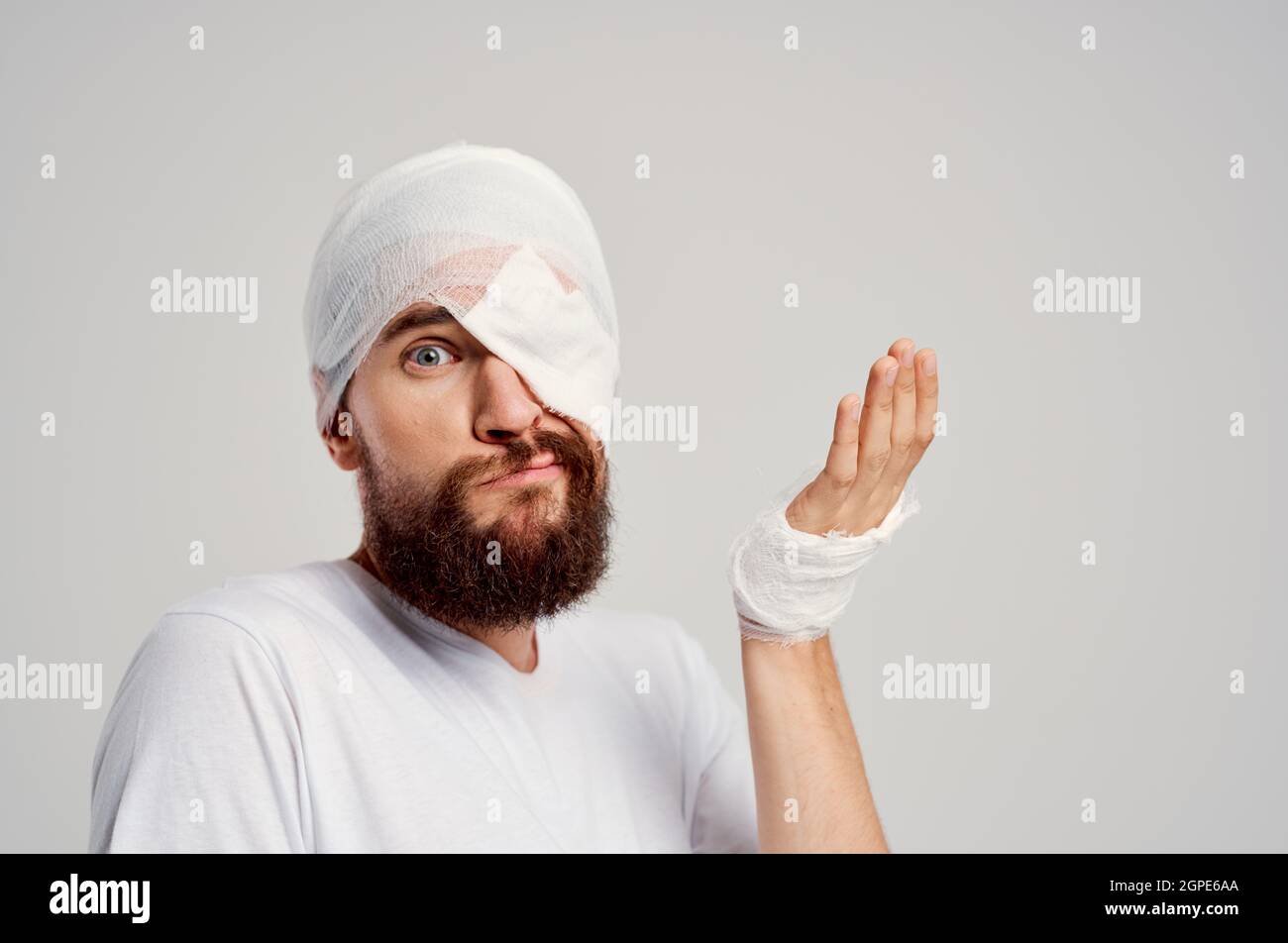 bearded man with bandaged head and eye hospitalization hospital ...