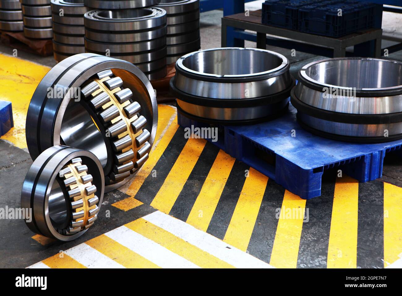 Ready-made large-diameter bearings lie on the floor of the factory room ...