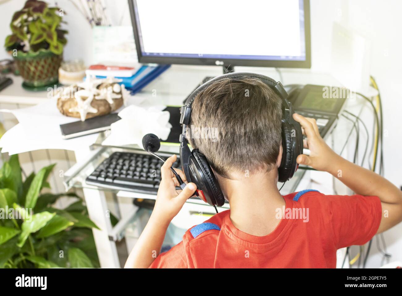 Isolation in children due to addiction to new technologies Stock Photo ...