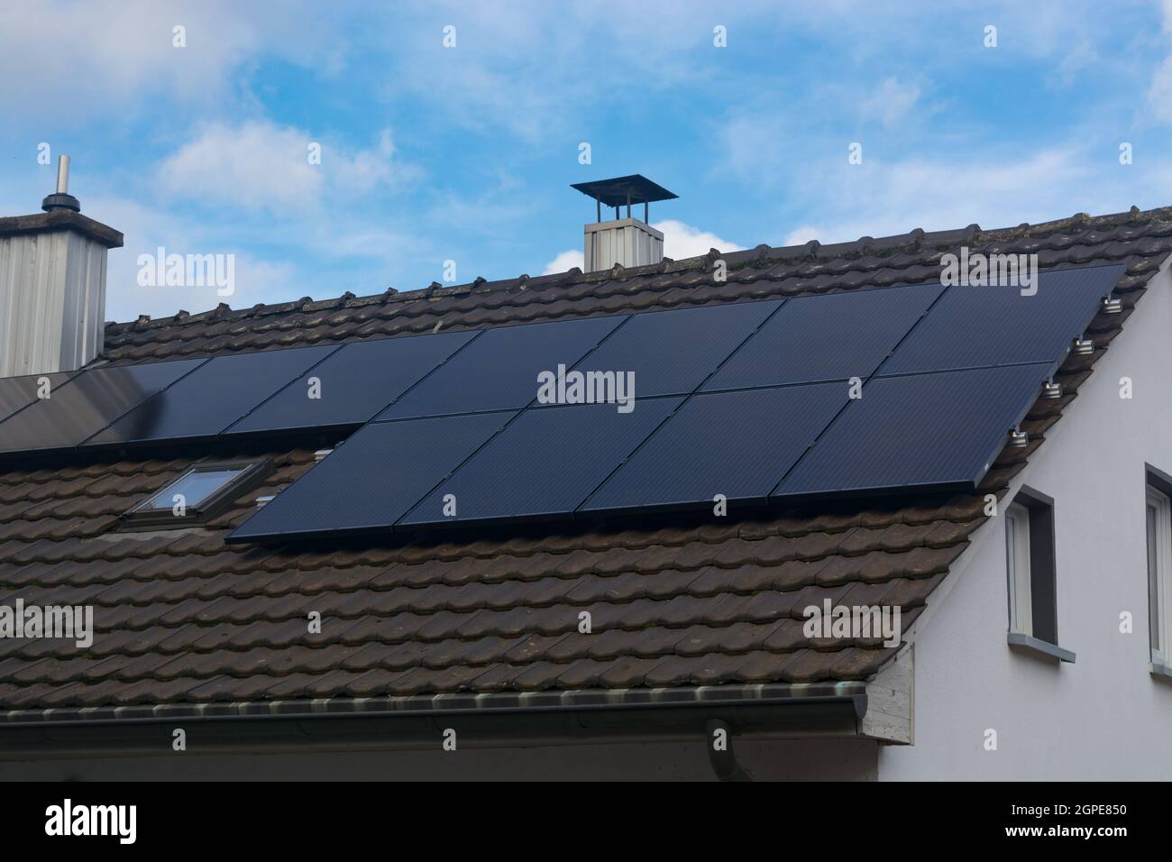 Modern house with a photovoltaic system, solar panels for electricity ...