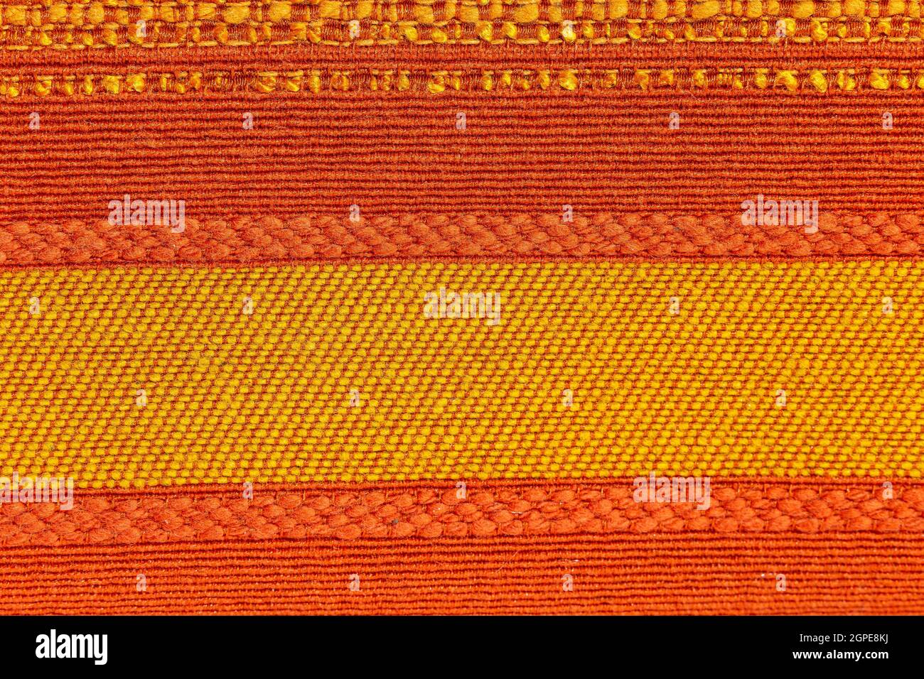Rustic canvas fabric texture in red, orange and yellow woven color ...