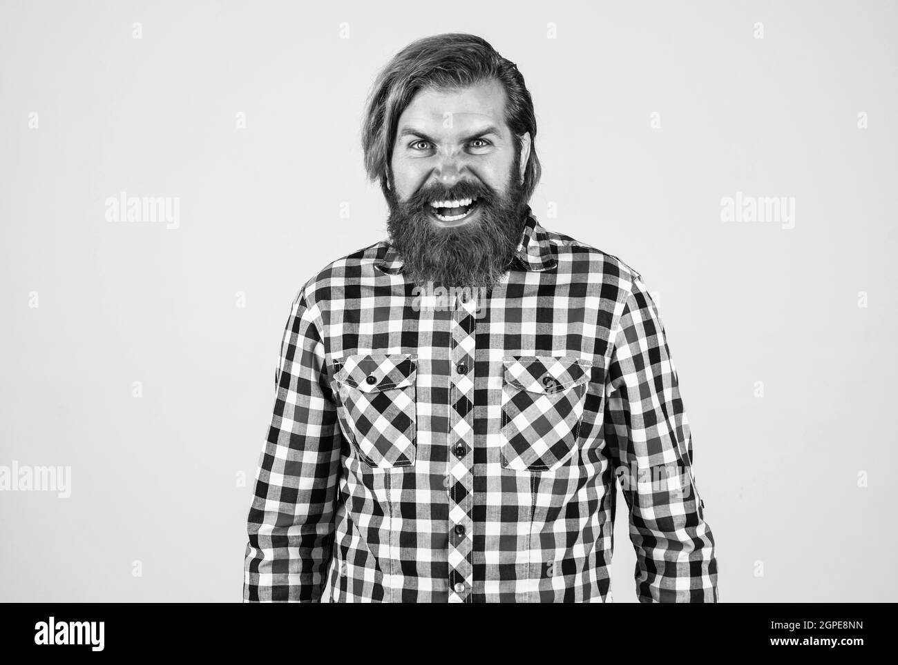 angry handsome bearded guy with unshaven face and stylish hairdo wear ...