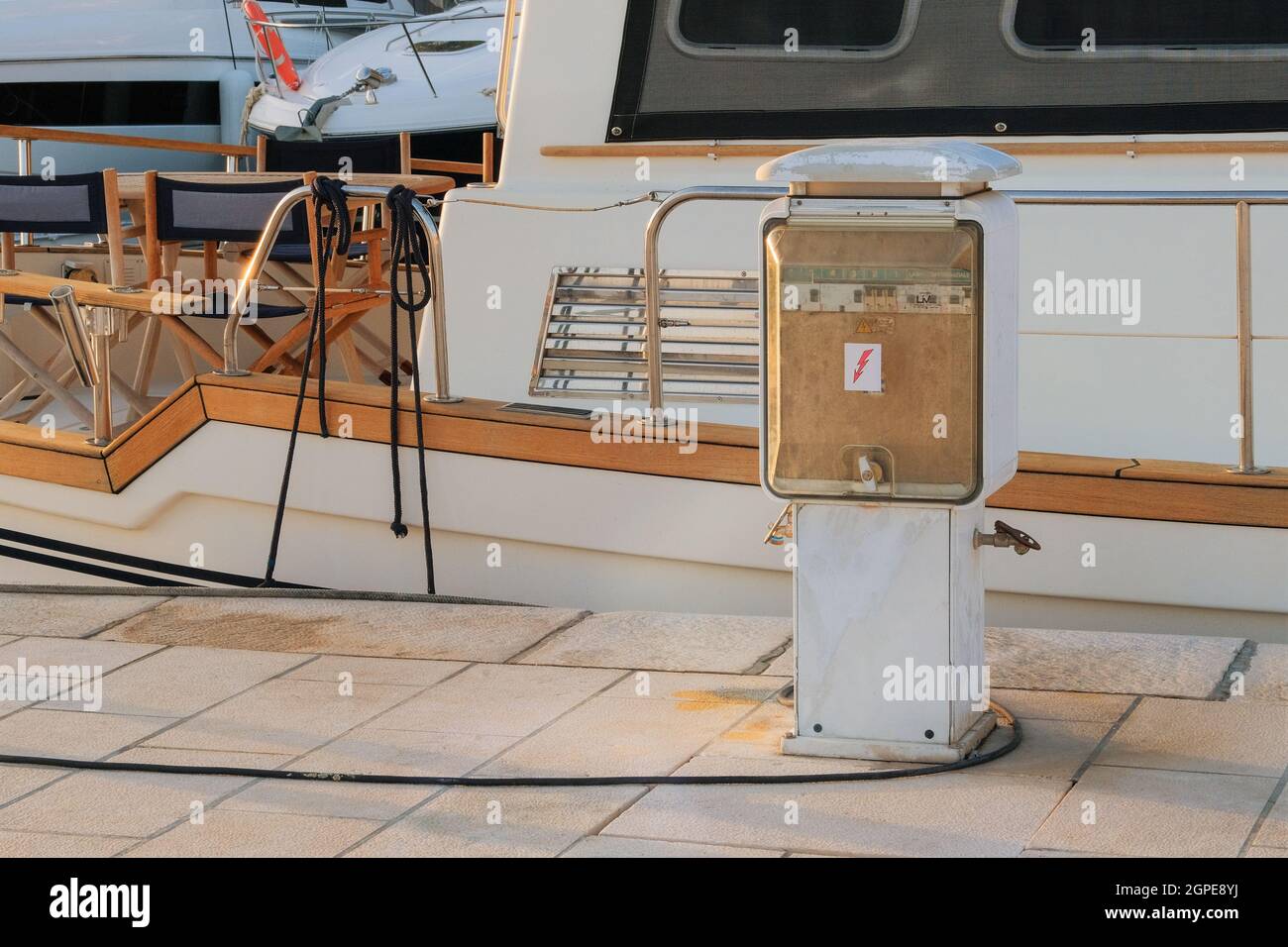 Refueling yachts with water on yacht dock in sea coast. Concierge ...